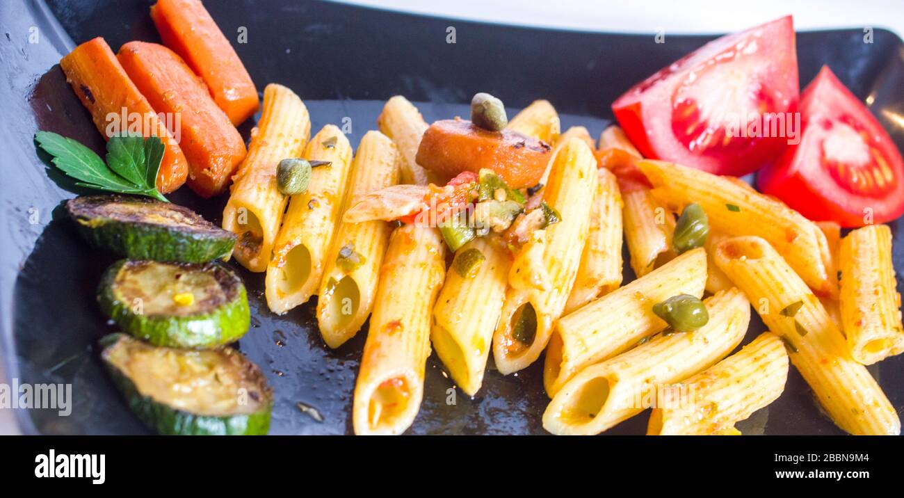 nourishing and healthy pasta, macaroni with colorful and tasty ...