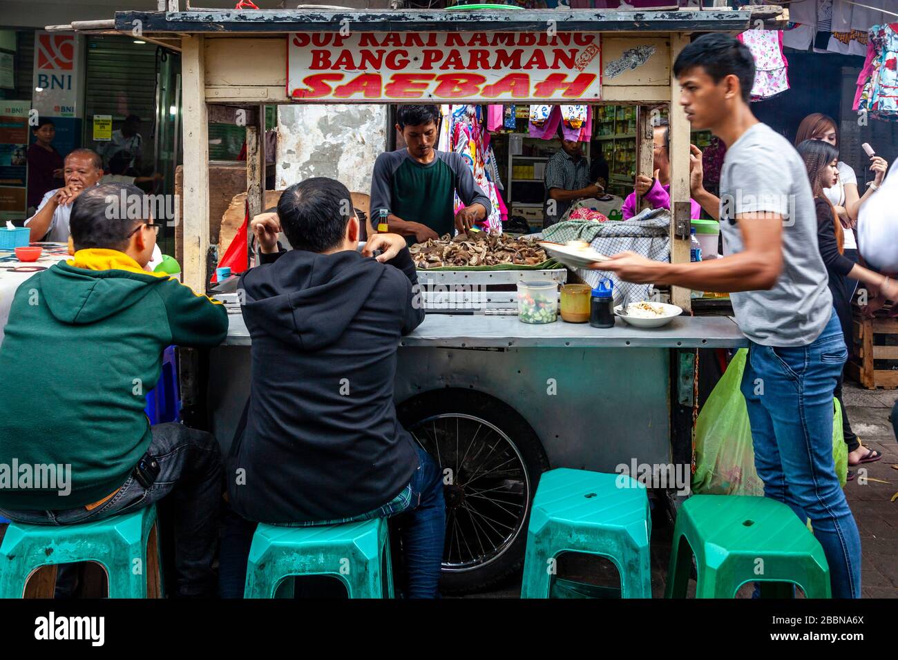 Indonesian People Eating At A Street Food Stall, Jakarta, Indonesia ...