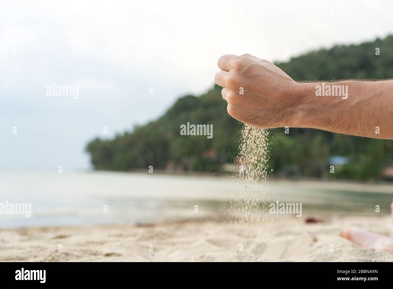Sand falling through hand hi-res stock photography and images - Alamy