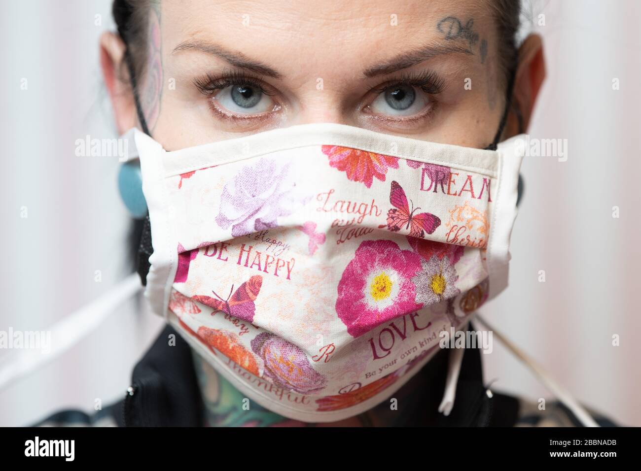 26 March 2020, Saxony, Zwickau: Daniela Beck, tattoo artist wears a ...