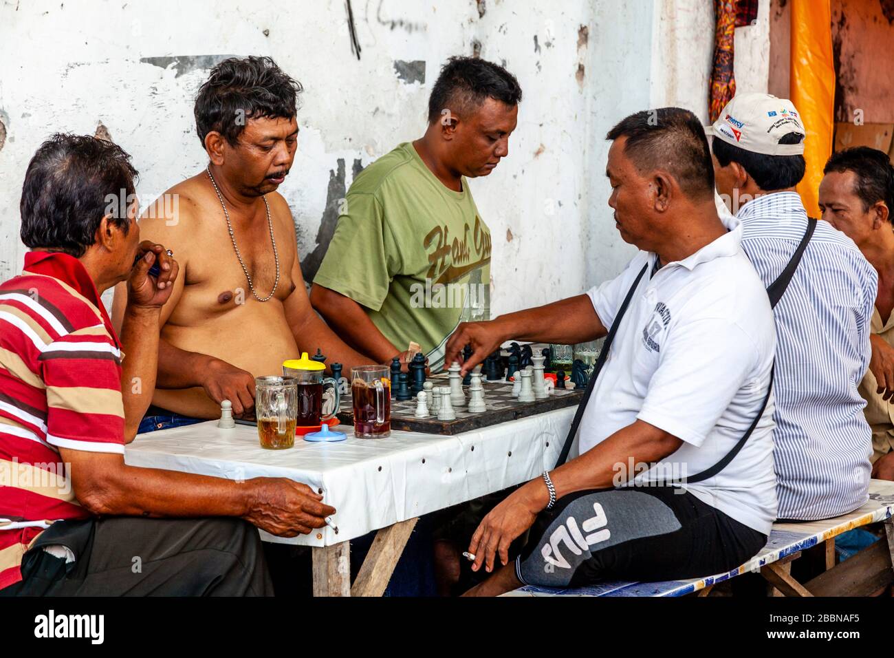 A Group Of Indonesian Men Playing Chess In The Street, Jakarta ...