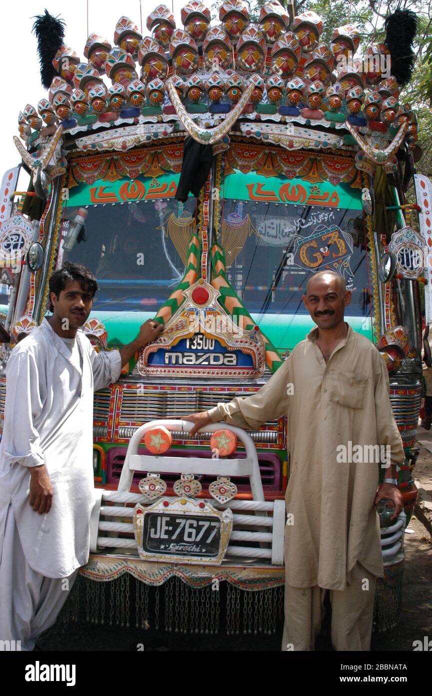 Drivers of an illustrated bus,Pakistan Stock Photo - Alamy
