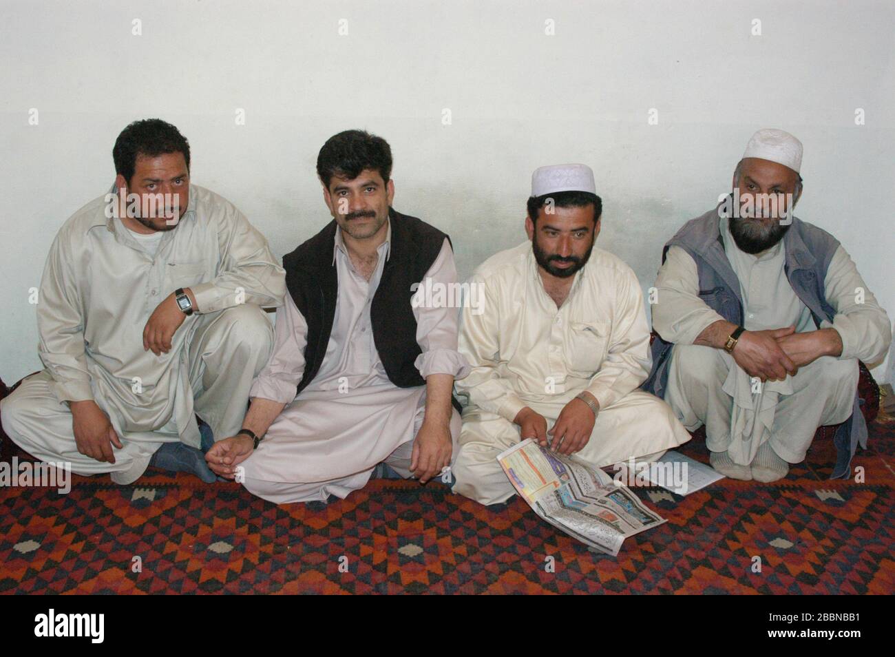 Four Patan Men sitting and talking,Pakistan Stock Photo - Alamy