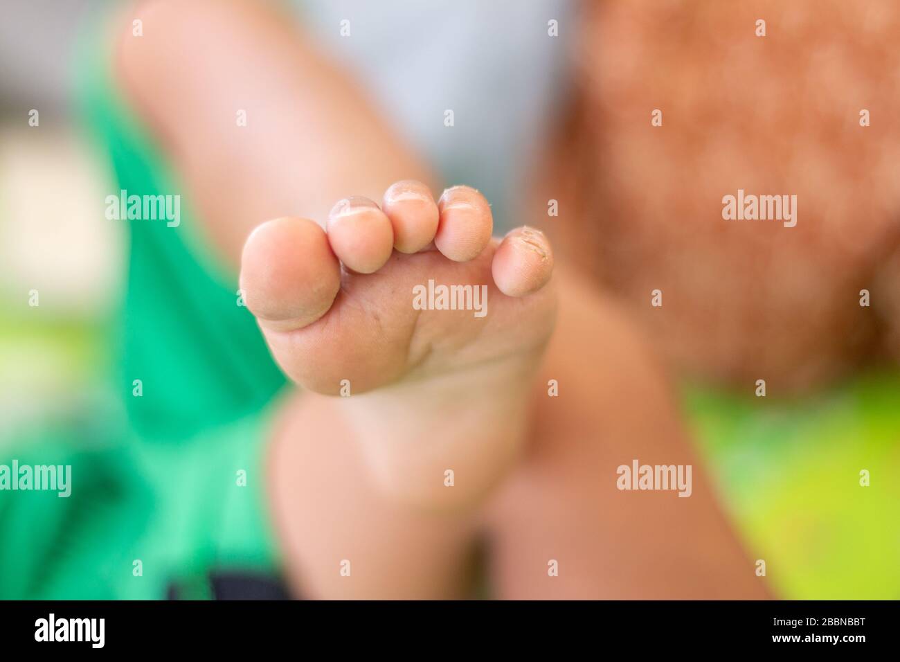 Child girl barefoot feet toes sitting hi-res stock photography and ...