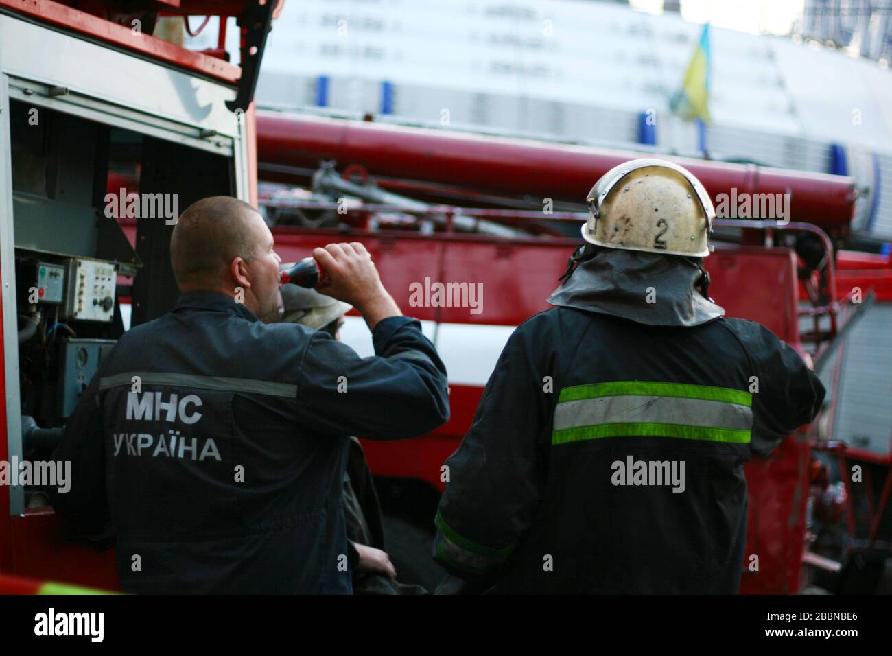 At the scene of a fire in a building. Firefighters Work Concept Stock ...