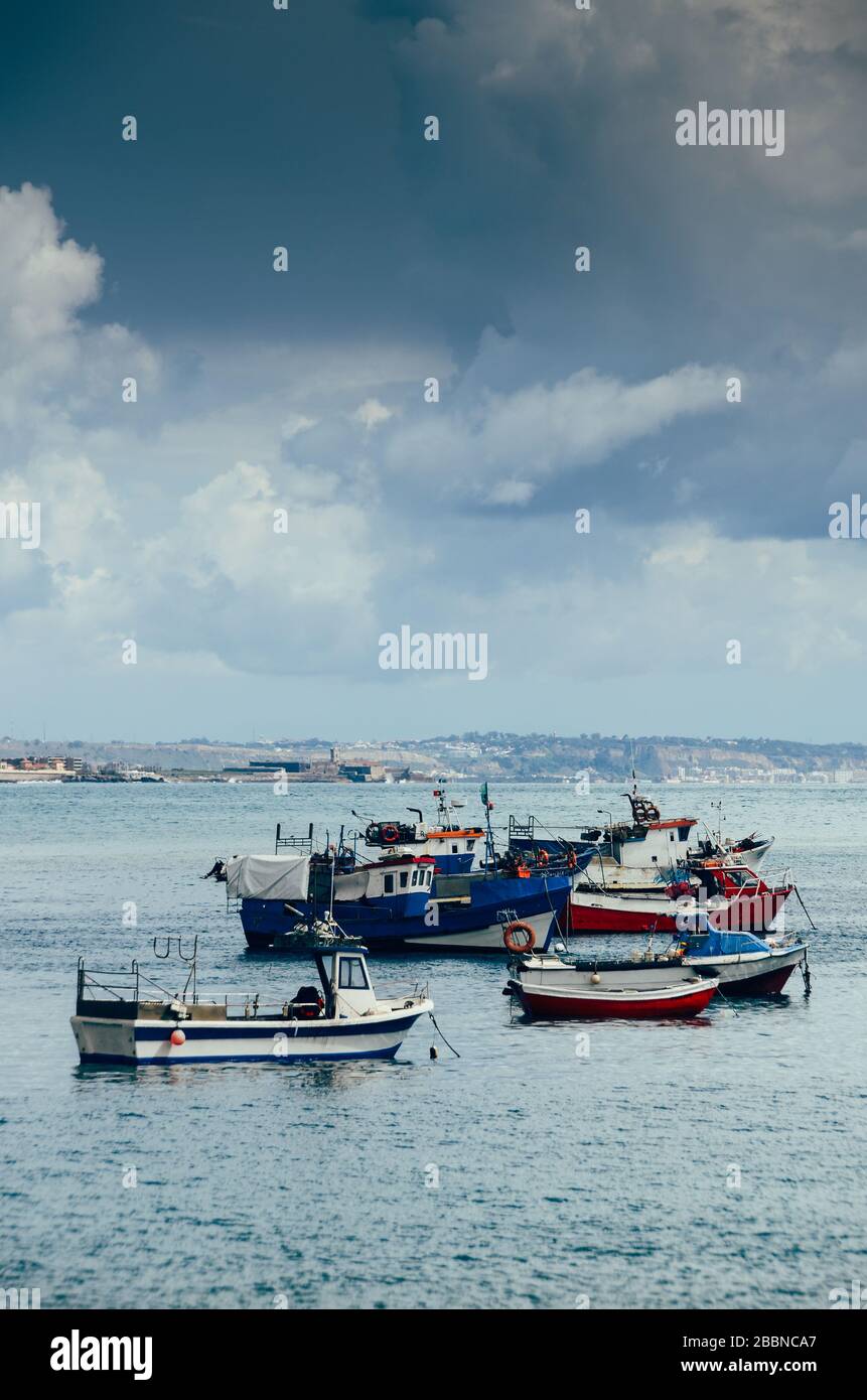 Fishing boats floating in the fish port of Cascais - Portugal Stock ...