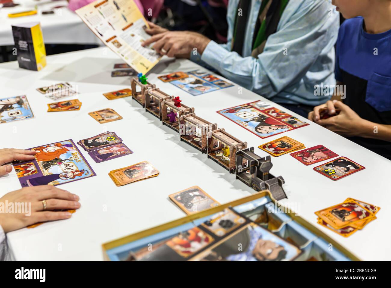 People playing at “Colt Express” at the game and toy fair of Quebec ...
