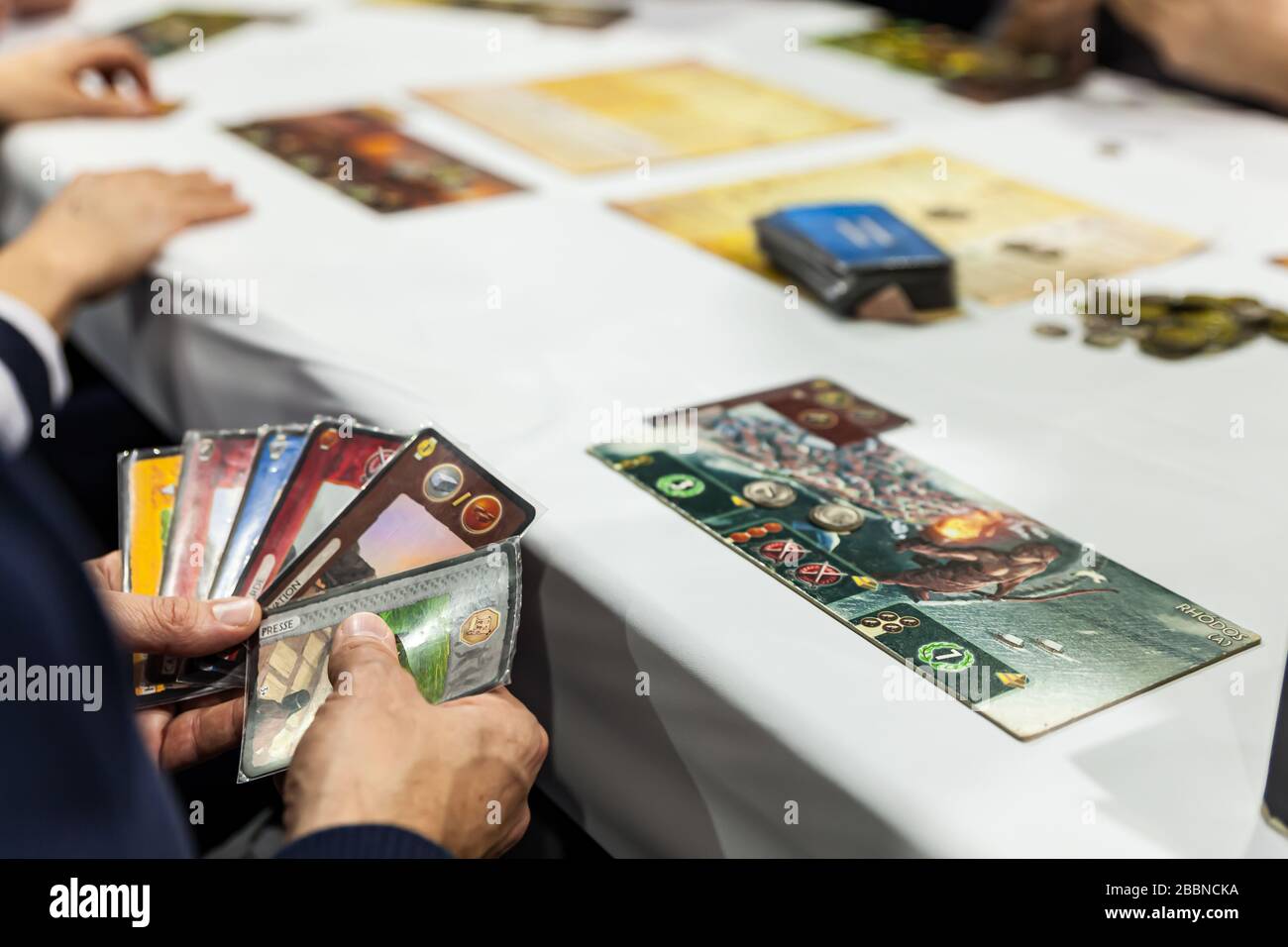 People playing at “7 Wonders” at the game and toy fair of Quebec City ...