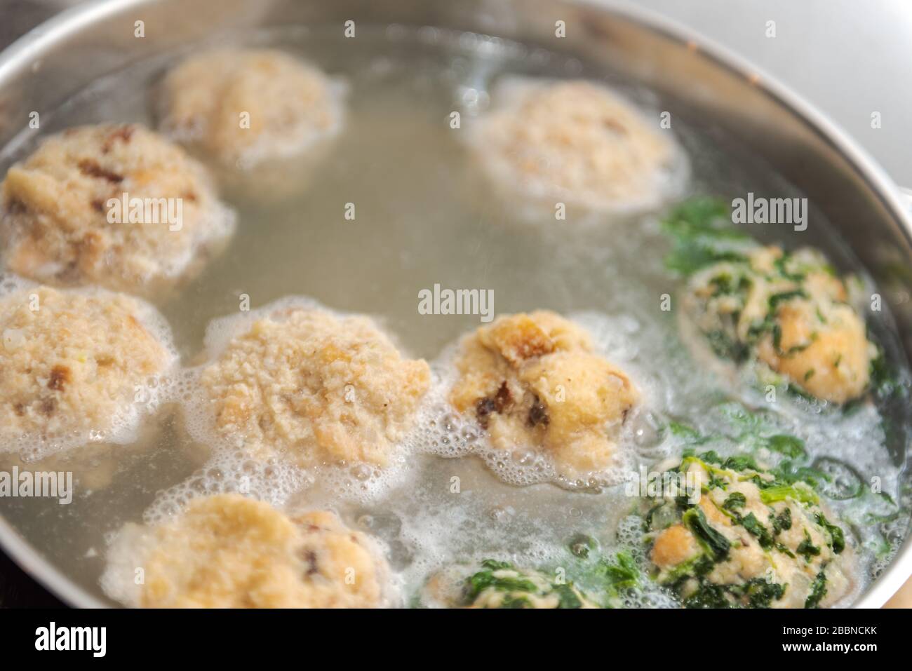 Close up of three different kinds of bread dumplings with cheese, bacon ...