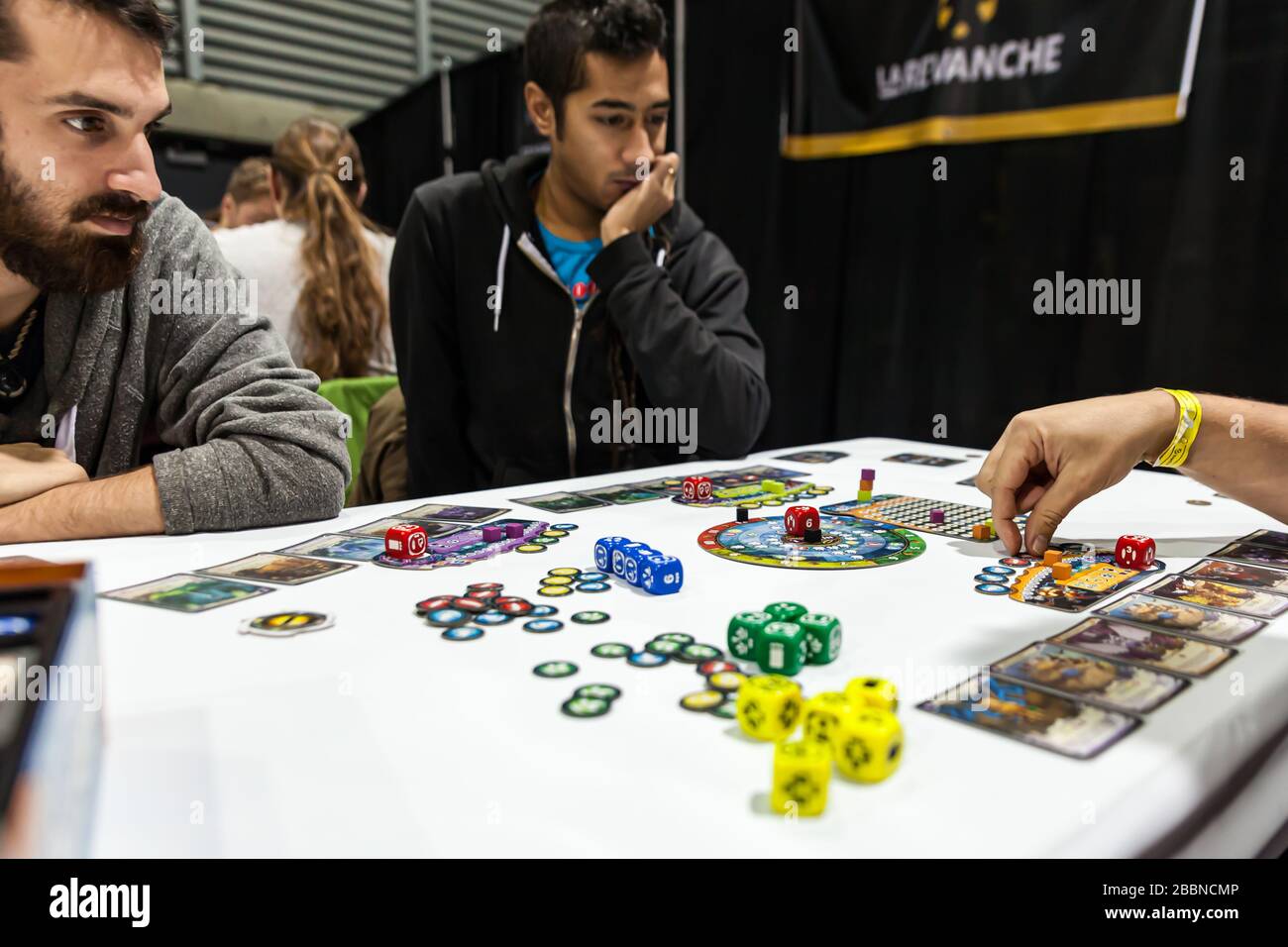 People playing at “Seasons” at the game and toy fair of Quebec City ...