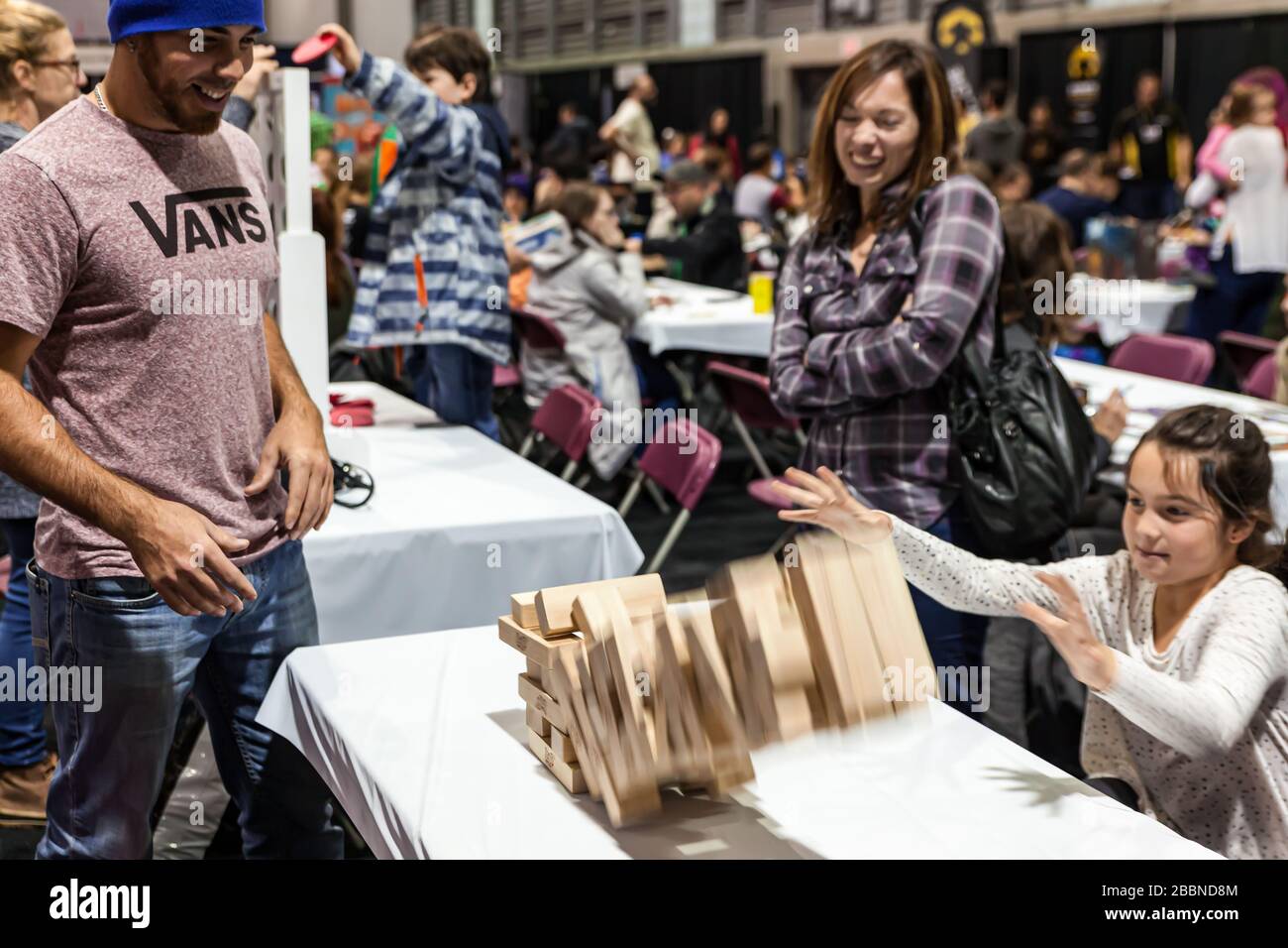 People playing at “Jenga” at the game and toy fair of Quebec City - La ...