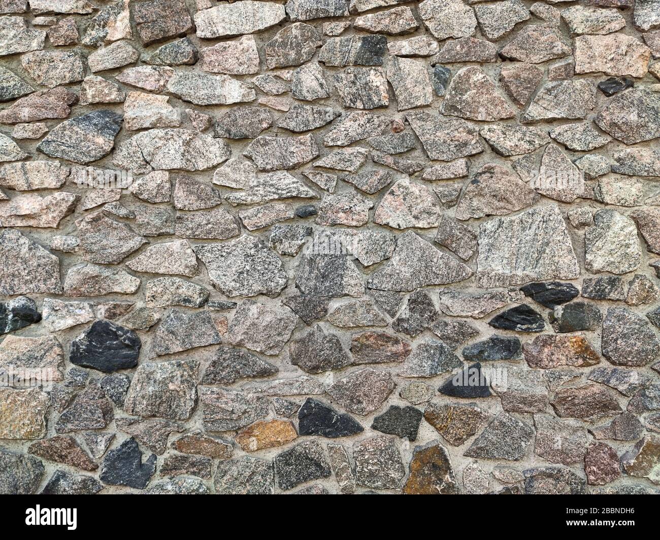 Background of large stones wall texture with different colors stones ...
