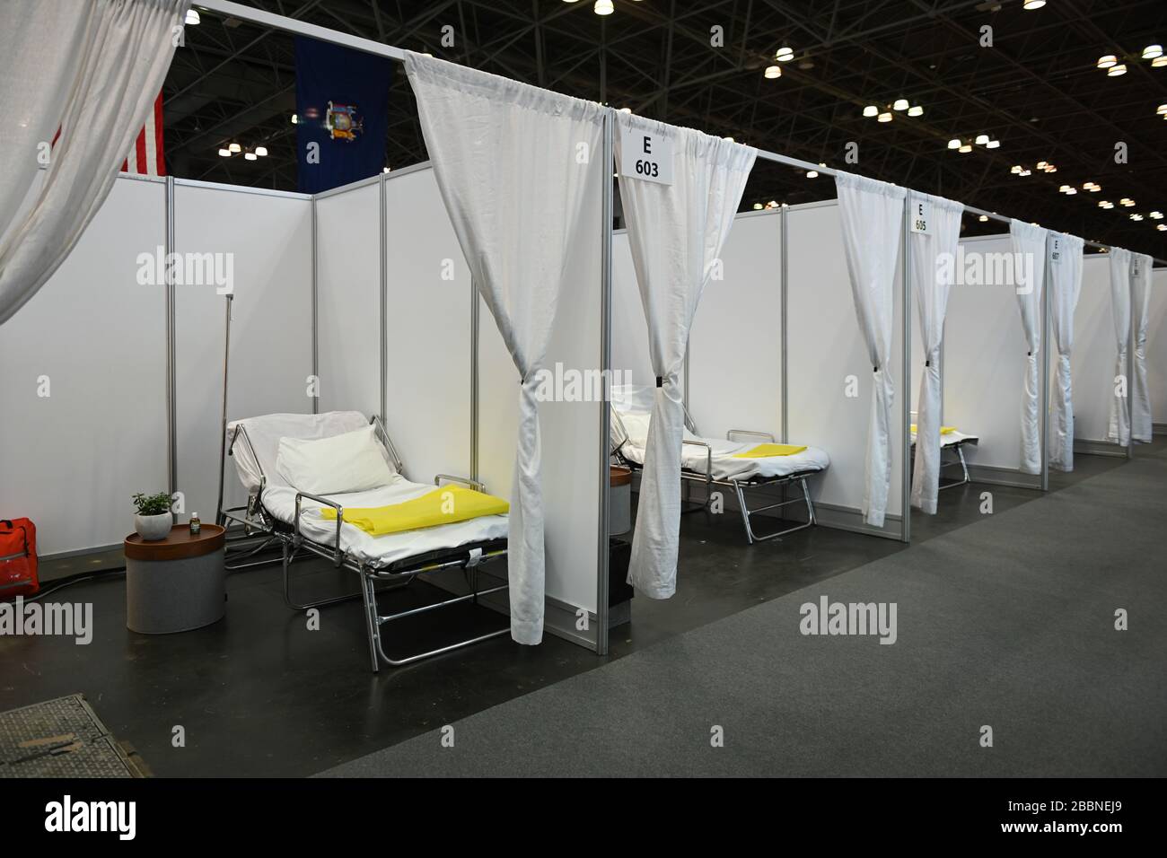Hospital bed booths are set up at the Jacob K. Javits Convention Center ...
