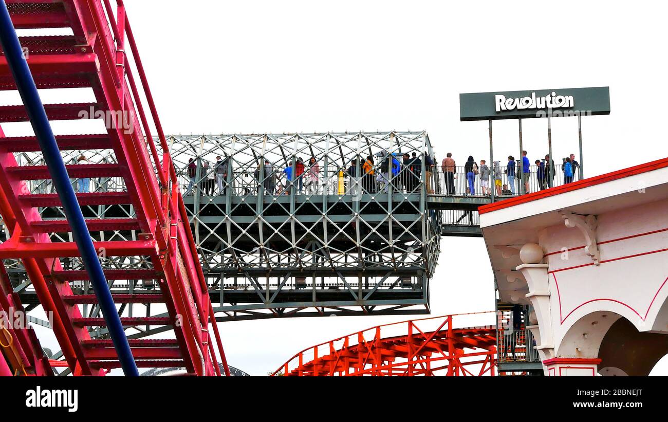 People queuing for the Revolution funfair ride at Blackpool Pleasure ...