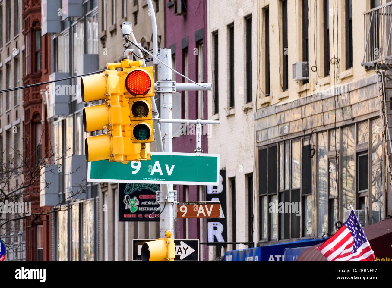 Red traffic light suspended above 9th Avenue in New York Stock Photo ...