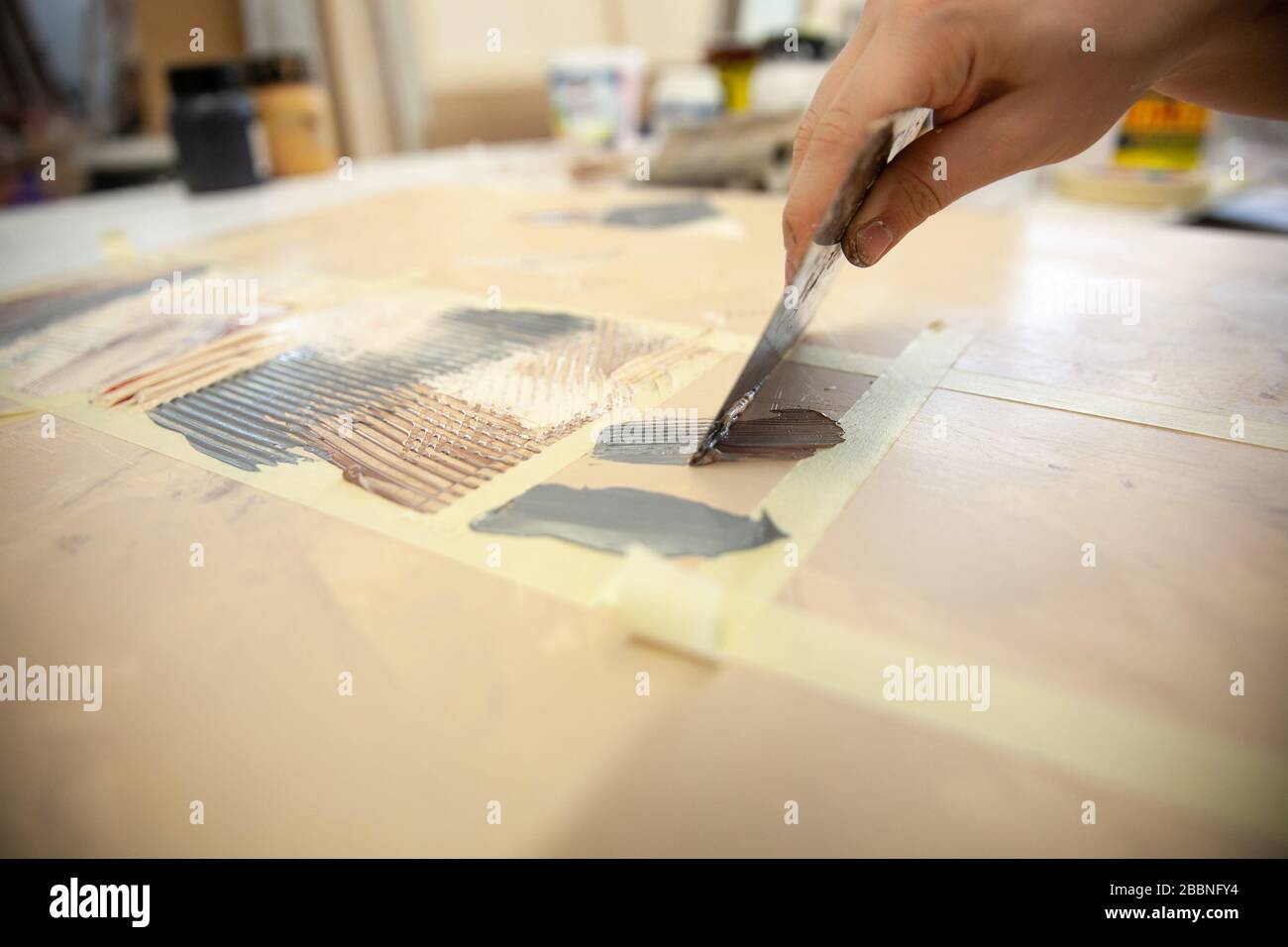 spreading the color on the palette close-up Stock Photo - Alamy