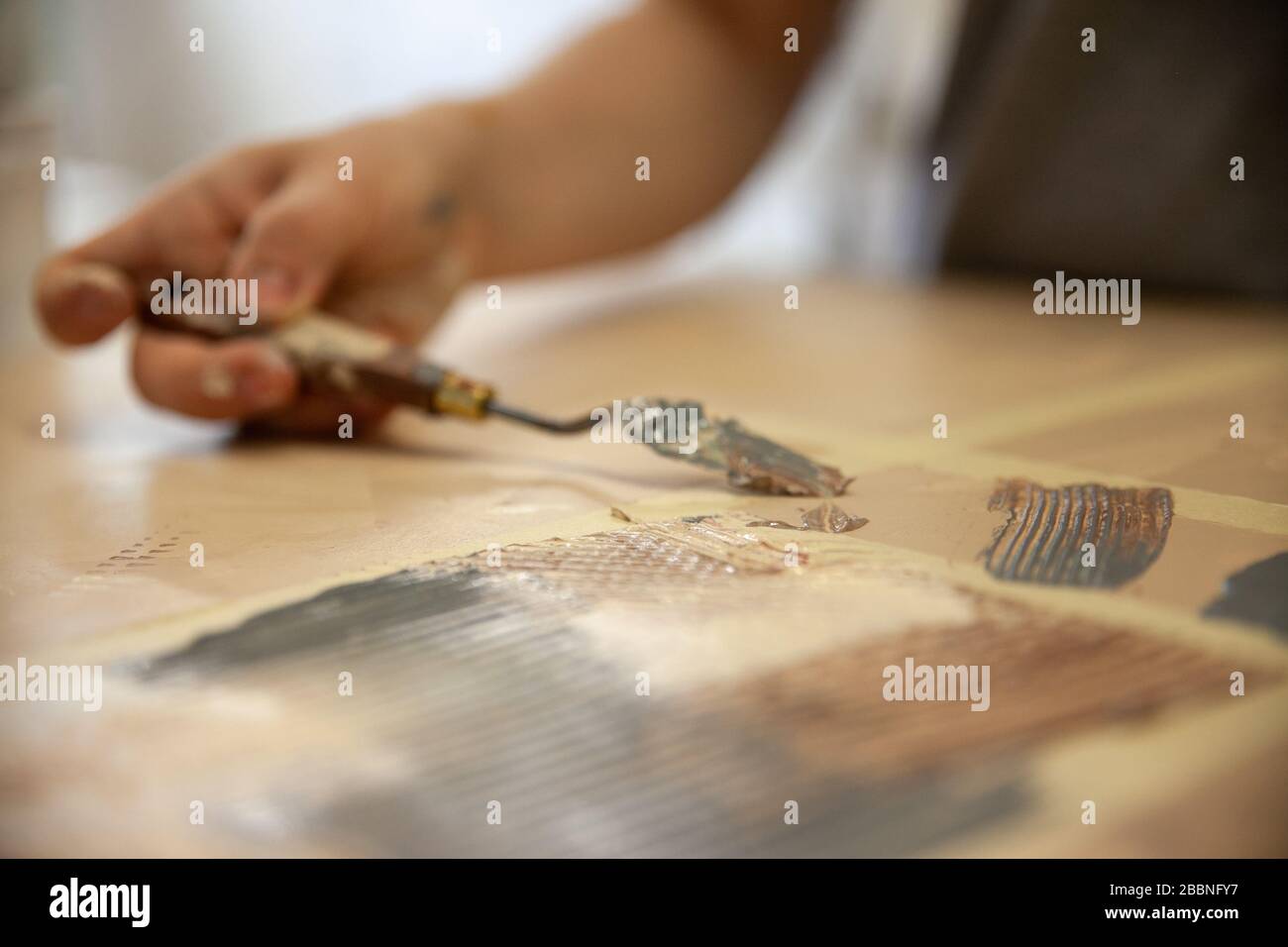 spreading the color on the palette close-up Stock Photo - Alamy