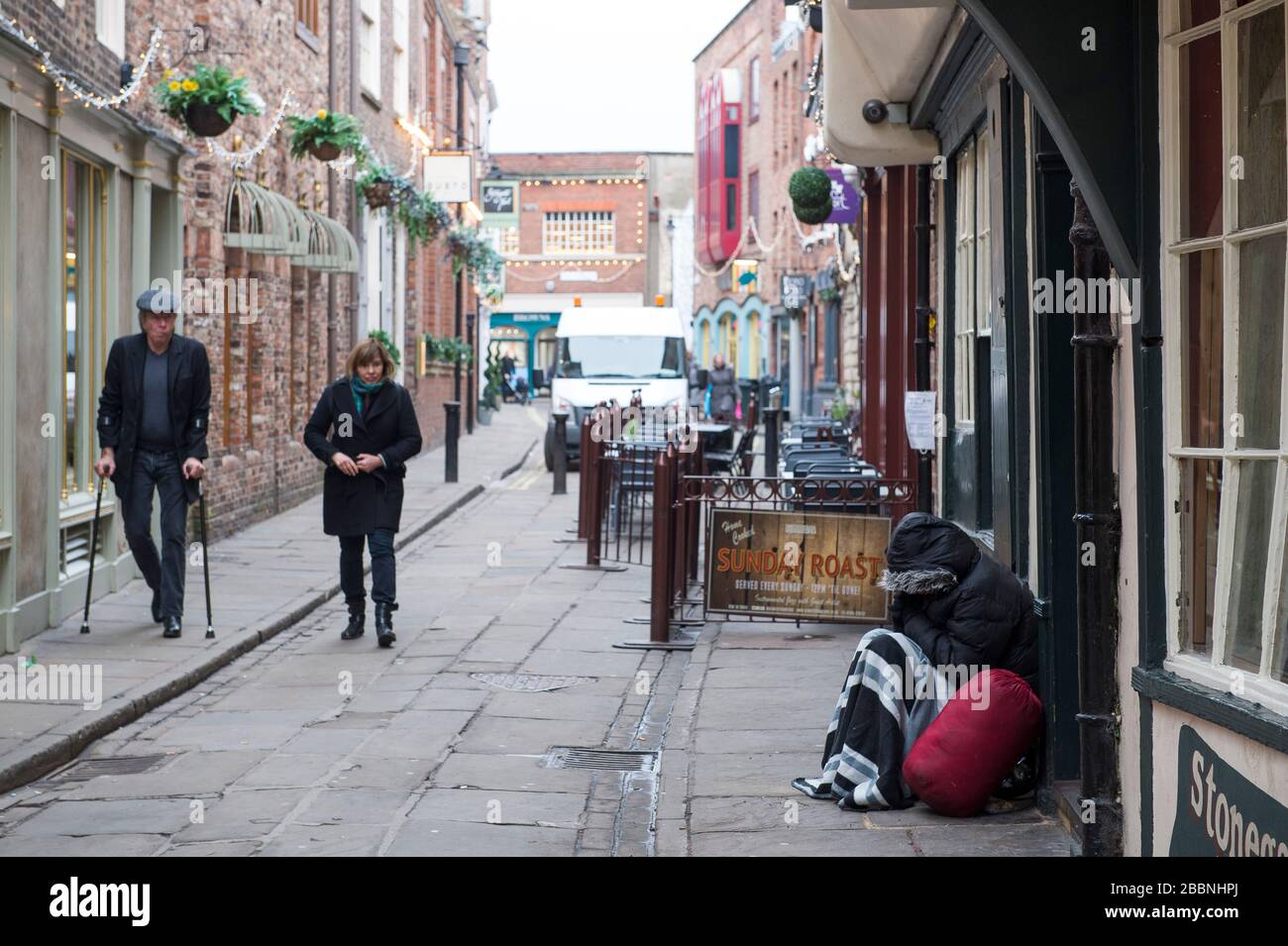 A homeless person on a street in York, UK Stock Photo - Alamy