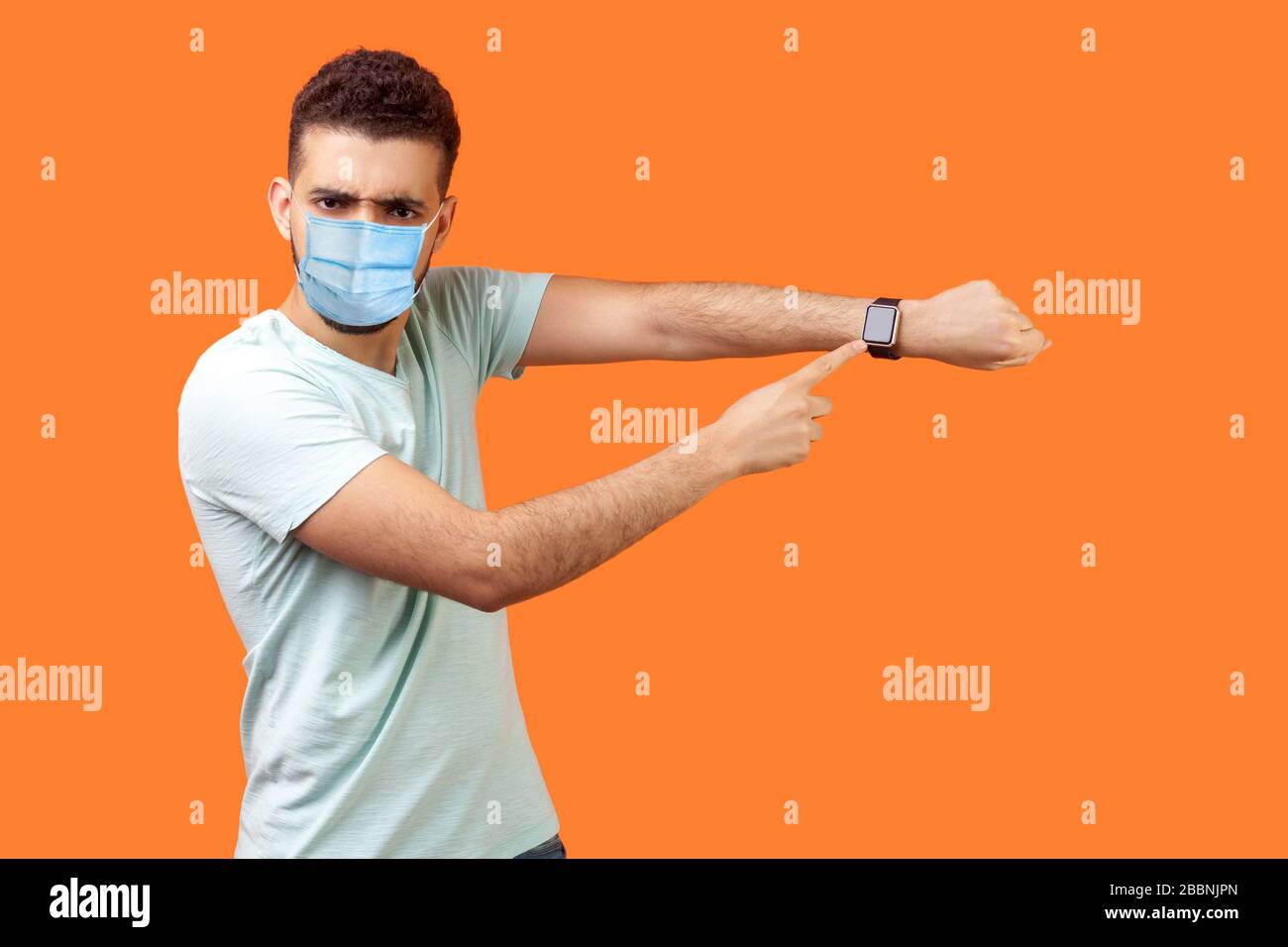 Time to go! Portrait of displeased impatient brunette man with surgical ...