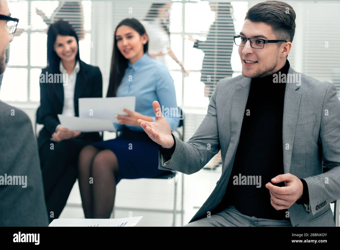 two employees discussing new ideas in the office Stock Photo - Alamy