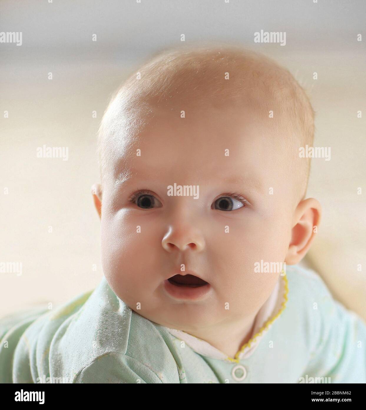 close up.portrait of a pretty little baby on blurred background Stock ...