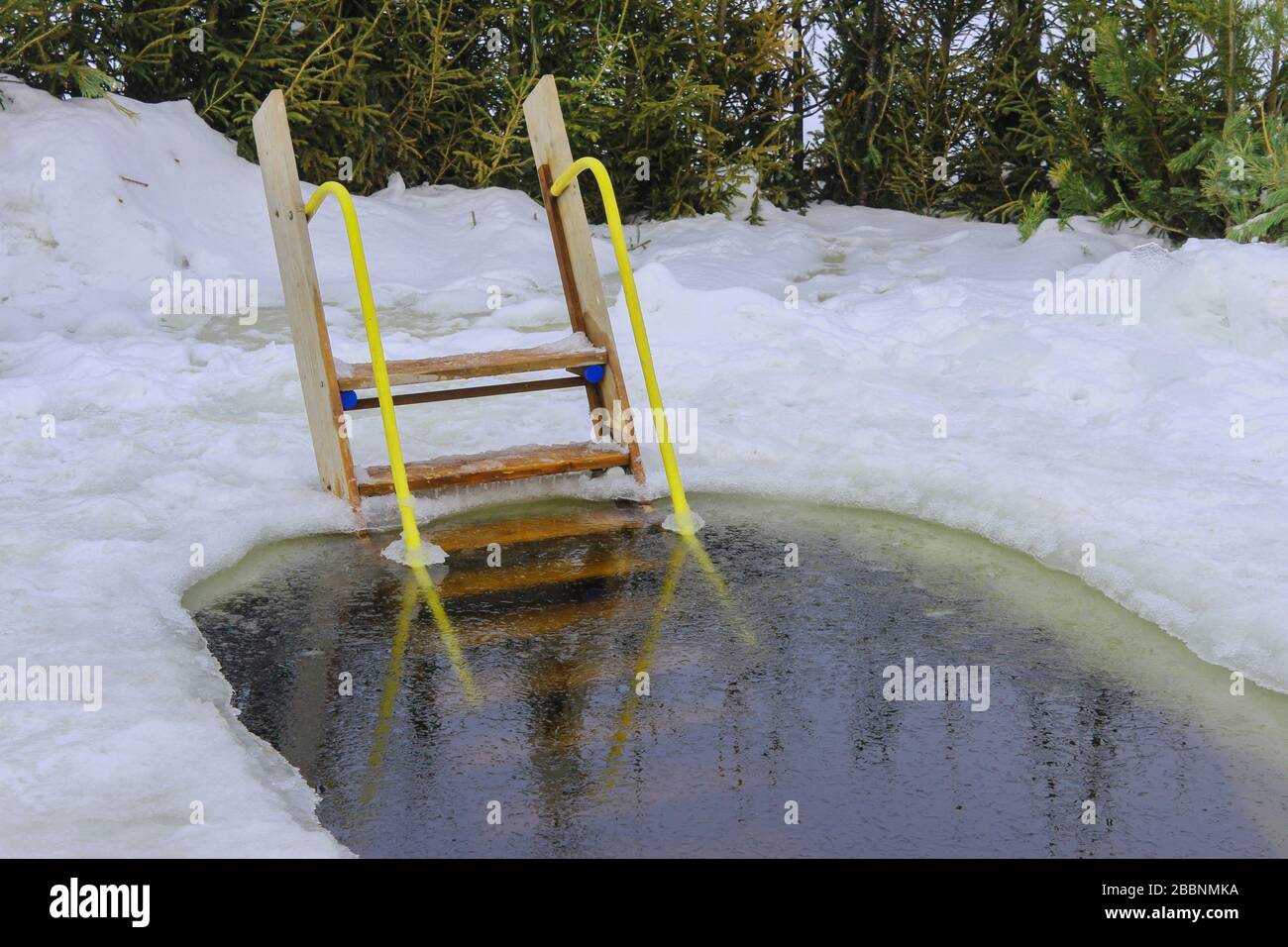 Epiphany ice hole on the Volga in winter, equipped with a ladder for ...