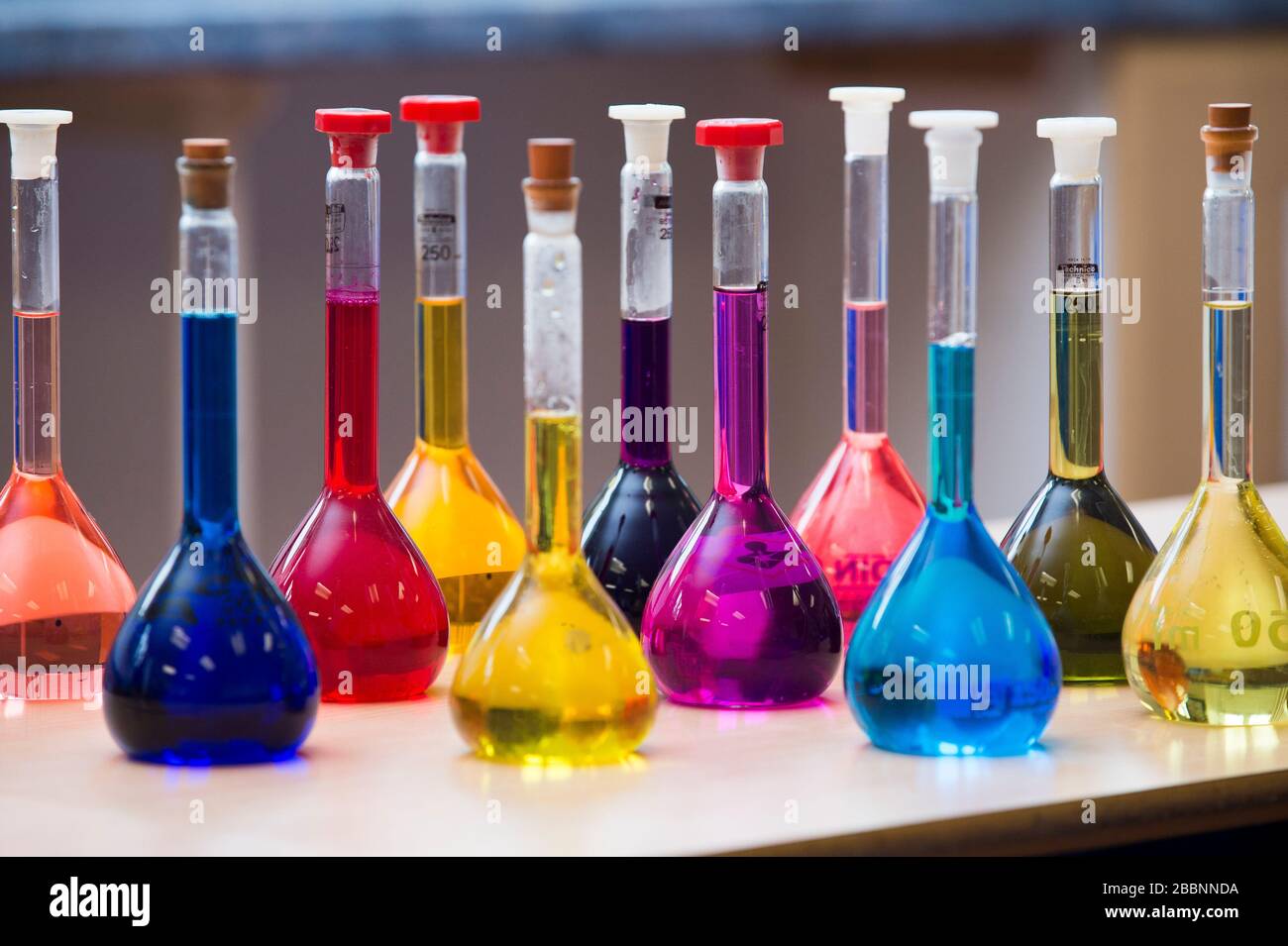 Coloured test tubes in a school science lab Stock Photo - Alamy