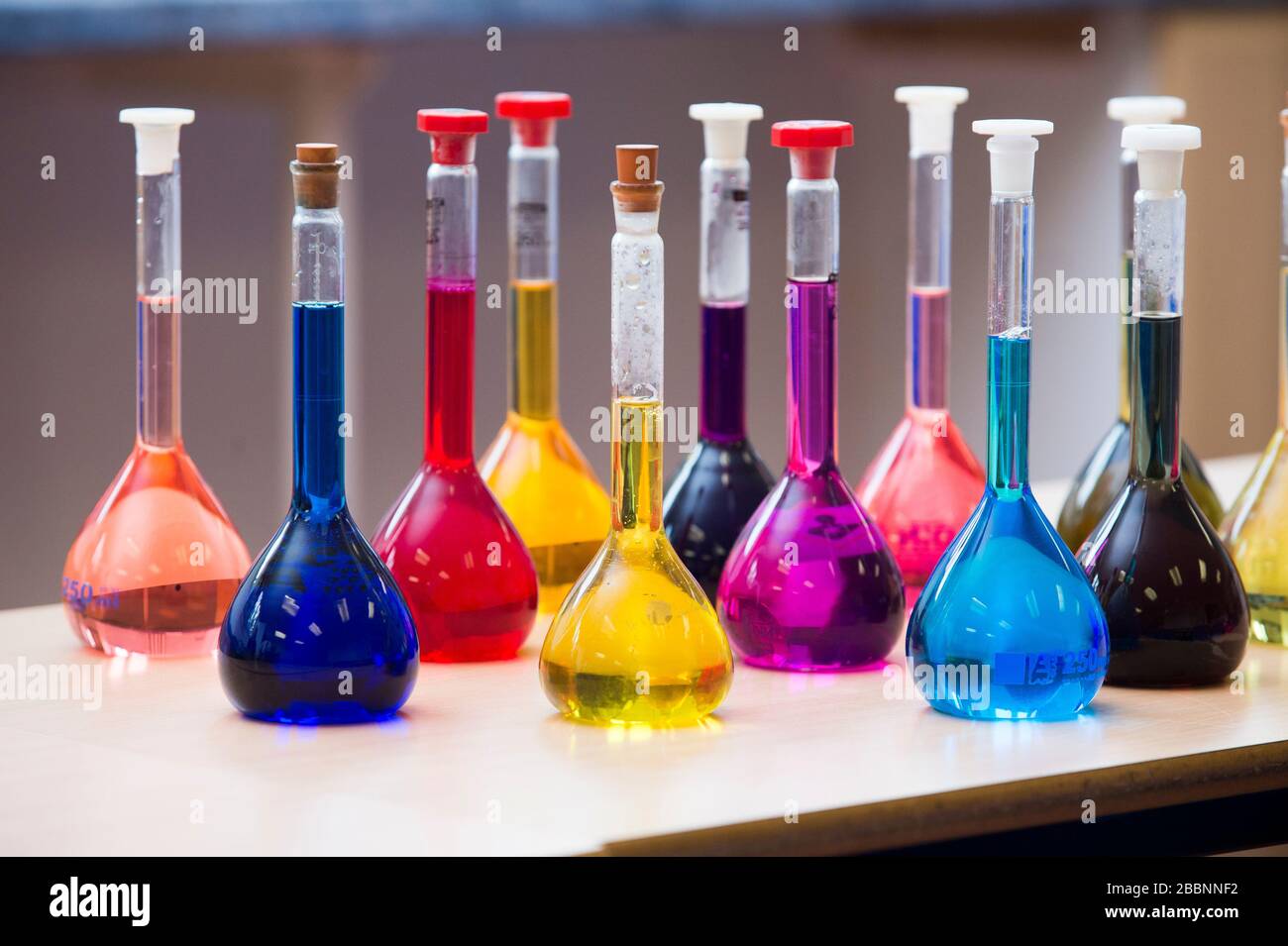 Coloured test tubes in a school science lab Stock Photo - Alamy