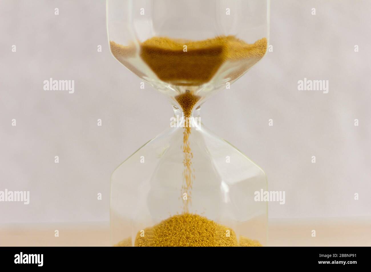 Hourglass close-up on a white background Stock Photo - Alamy