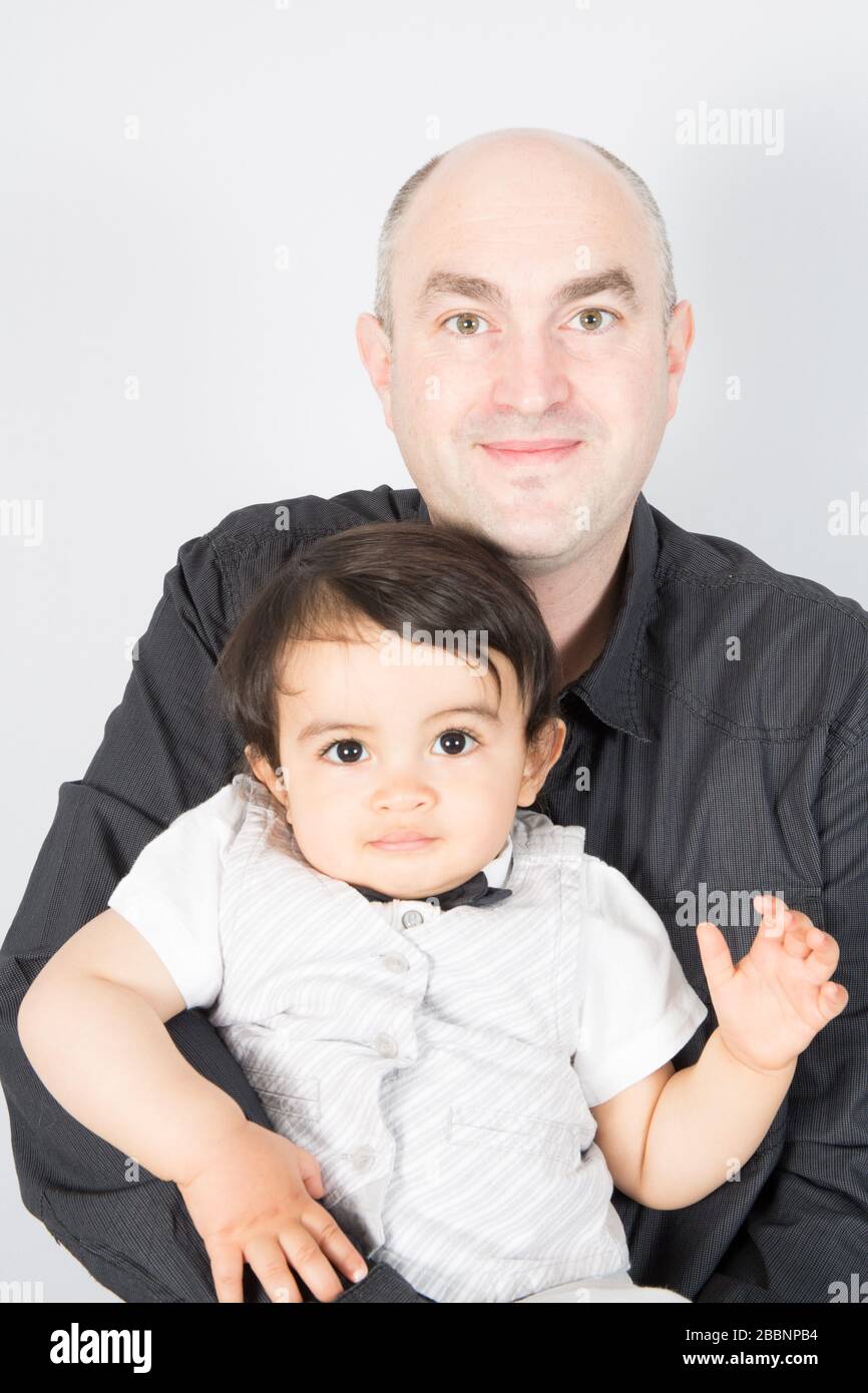 Casual studio shot of father and son. single man portrait Stock Photo ...