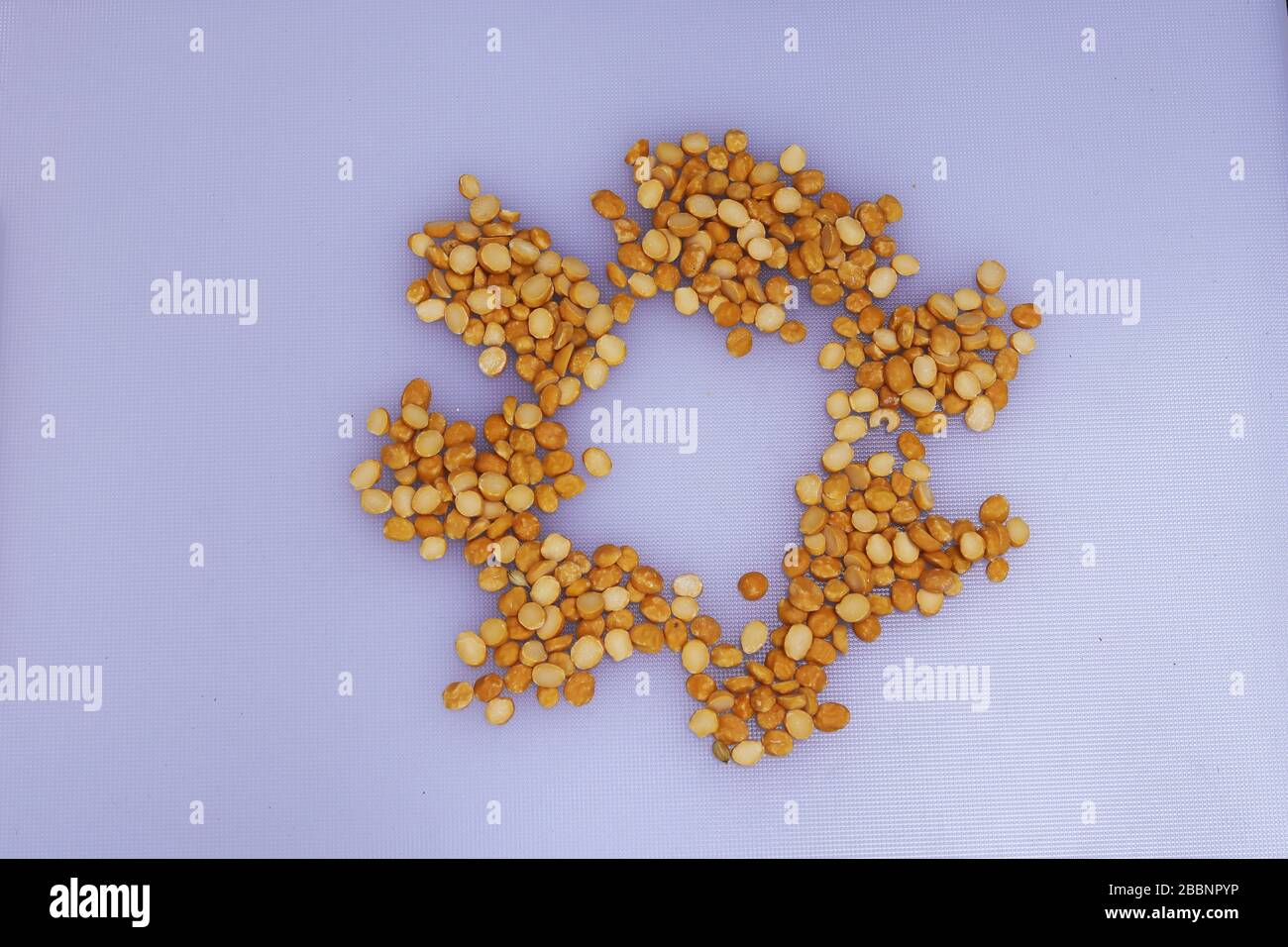 Yellow color split raw Chana dal or chickpeas lentils Stock Photo - Alamy
