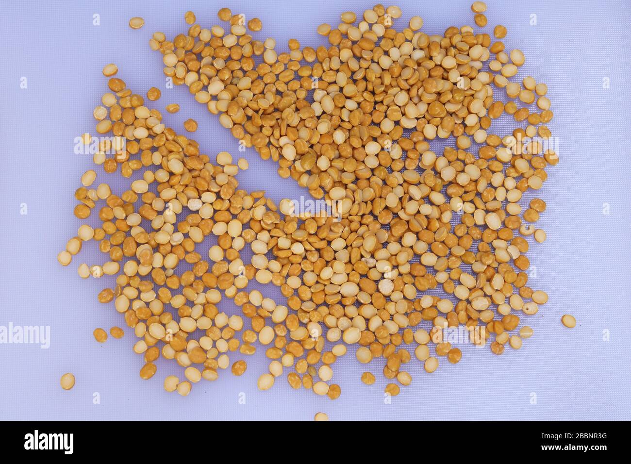 Yellow color split raw Chana dal or chickpeas lentils Stock Photo - Alamy