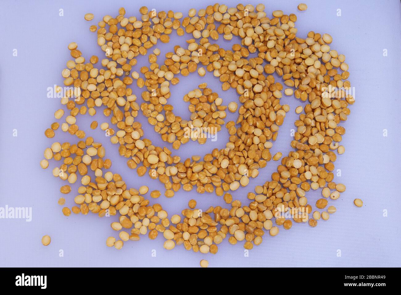 Yellow color split raw Chana dal or chickpeas lentils Stock Photo - Alamy