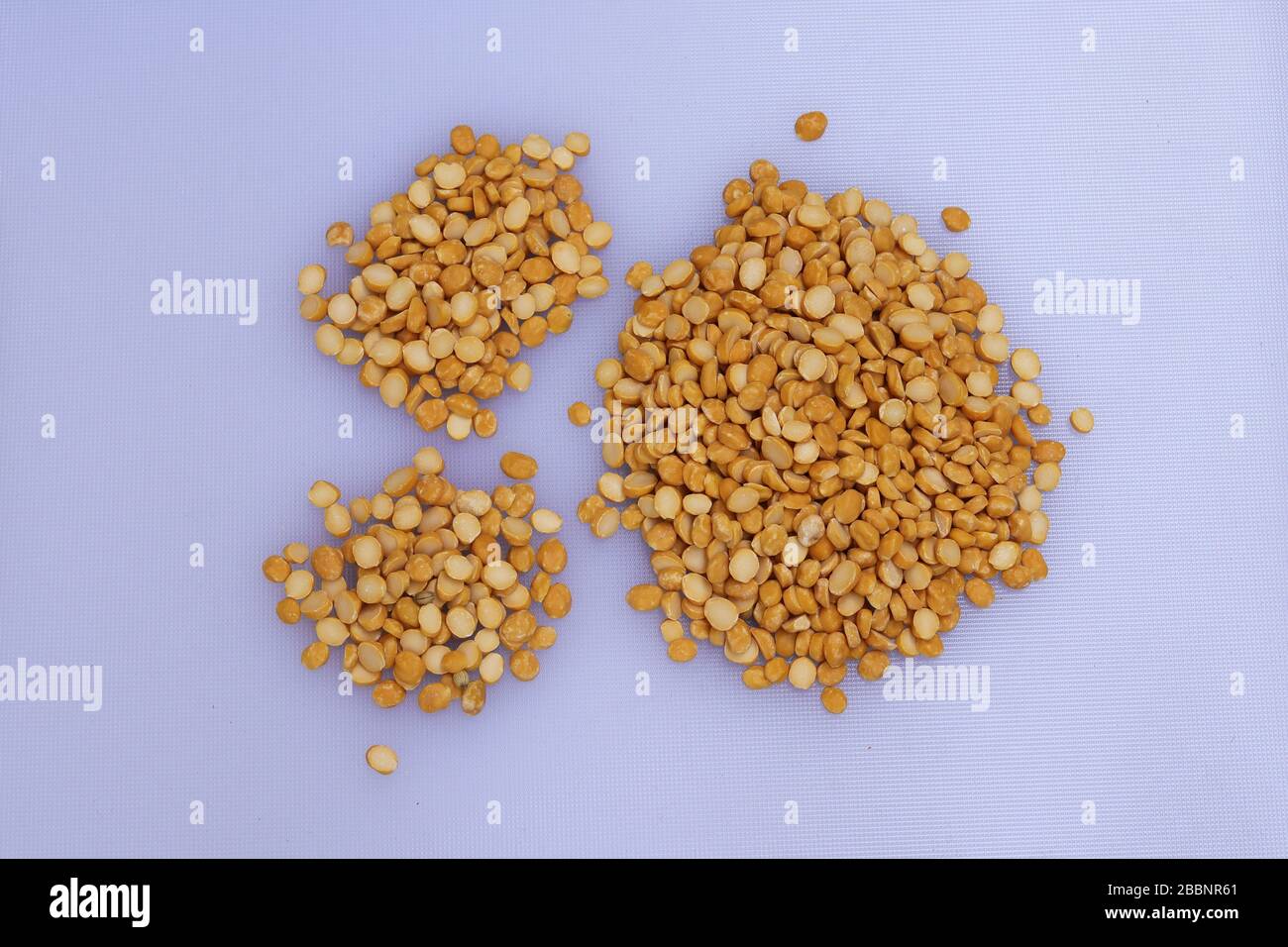 Yellow color split raw Chana dal or chickpeas lentils Stock Photo - Alamy