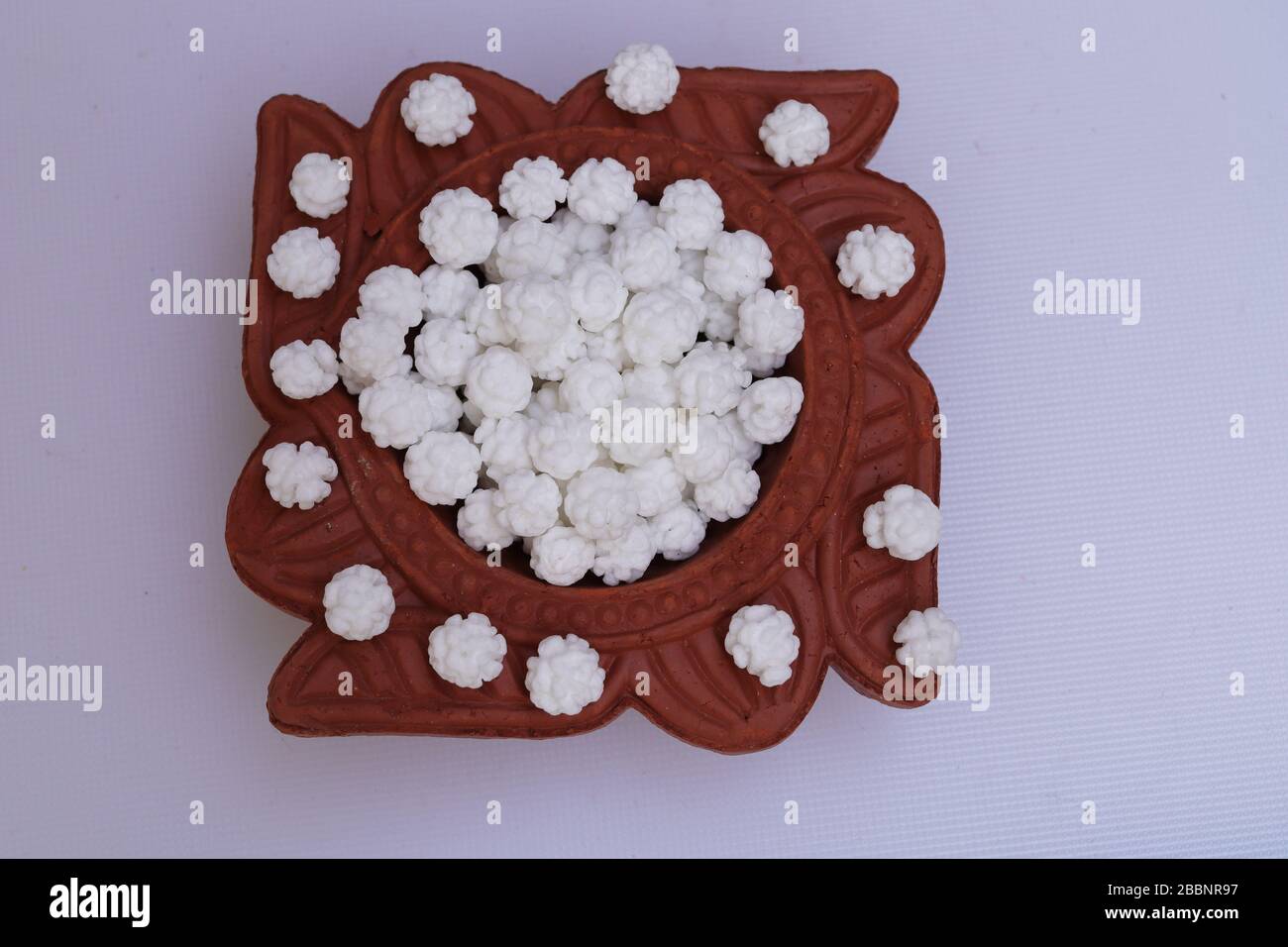 Nakul dana, sweet that made by sugar use as prasad in india Stock Photo ...