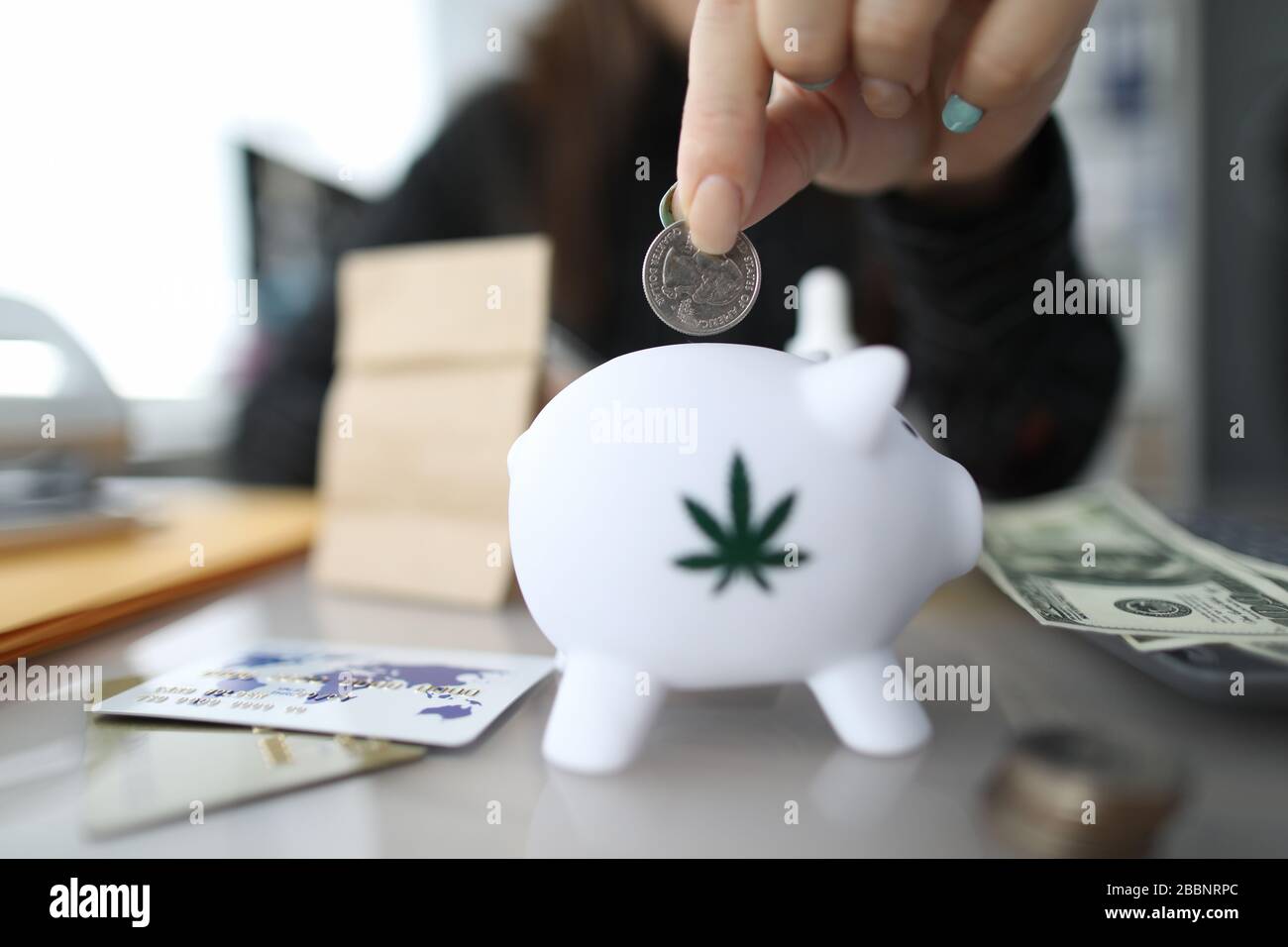 Woman holding silver coin hi-res stock photography and images - Alamy