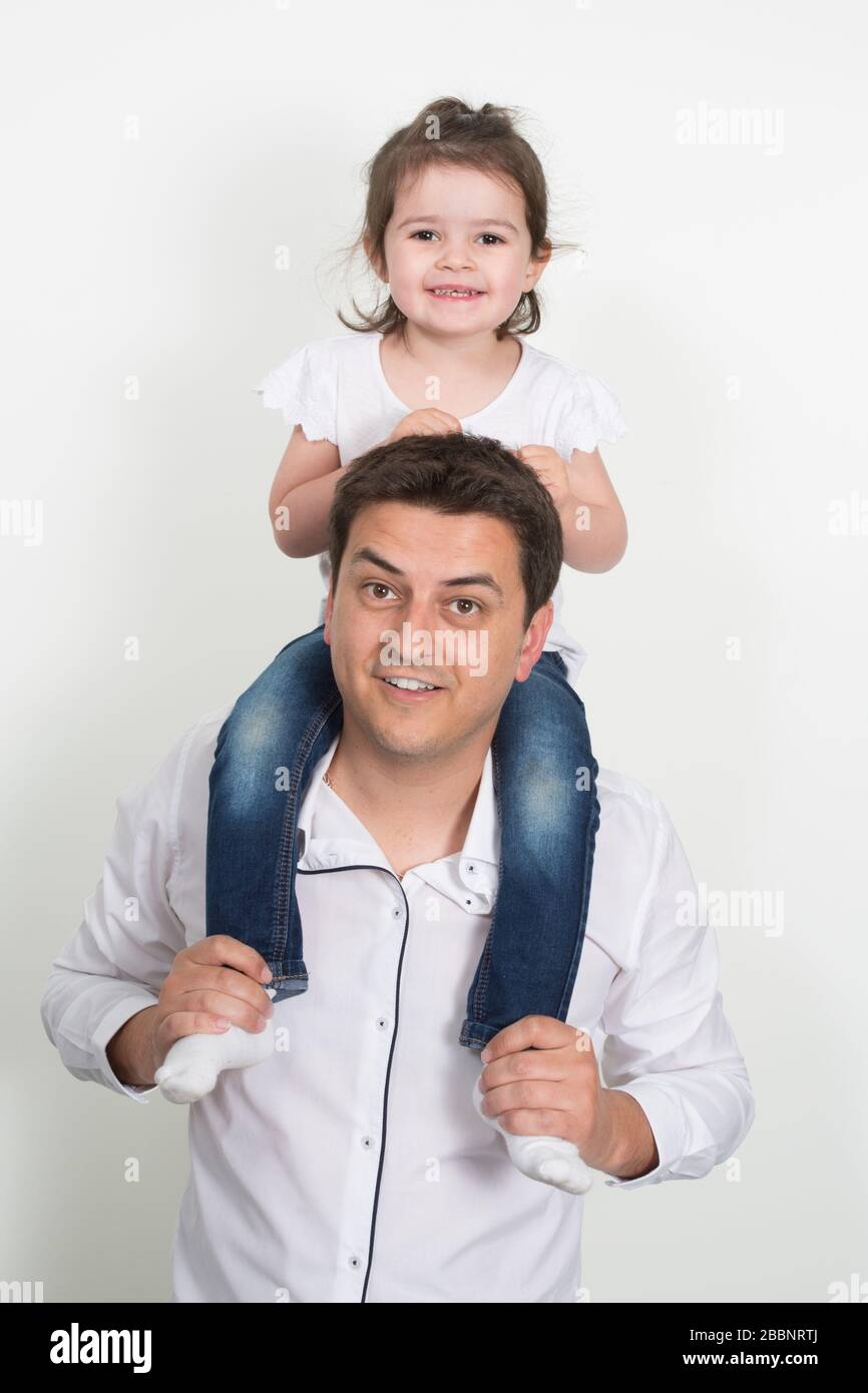 handsome father man piggyback with girl child daughter Stock Photo - Alamy