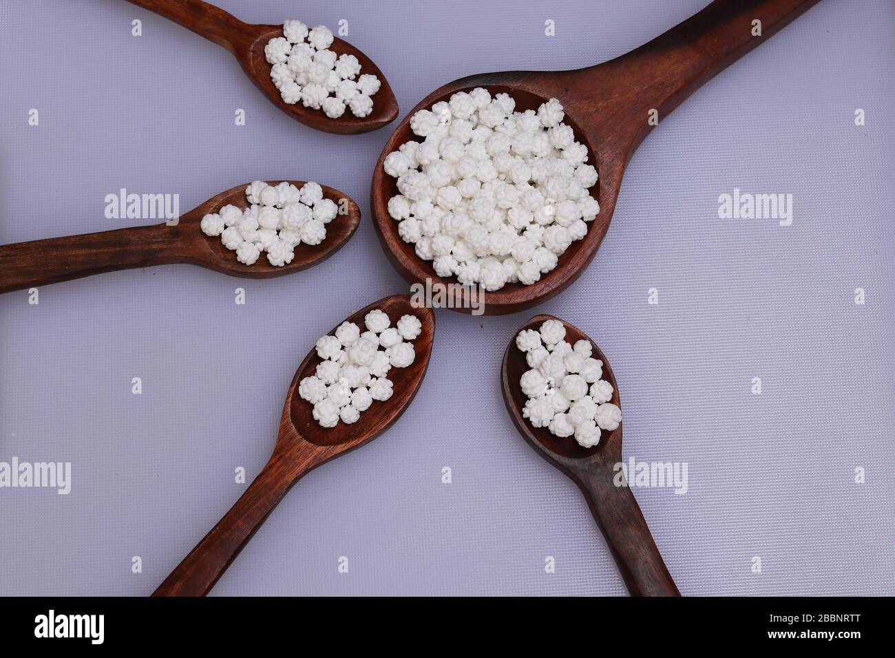 Nakul dana, sweet that made by sugar use as prasad in india Stock Photo ...