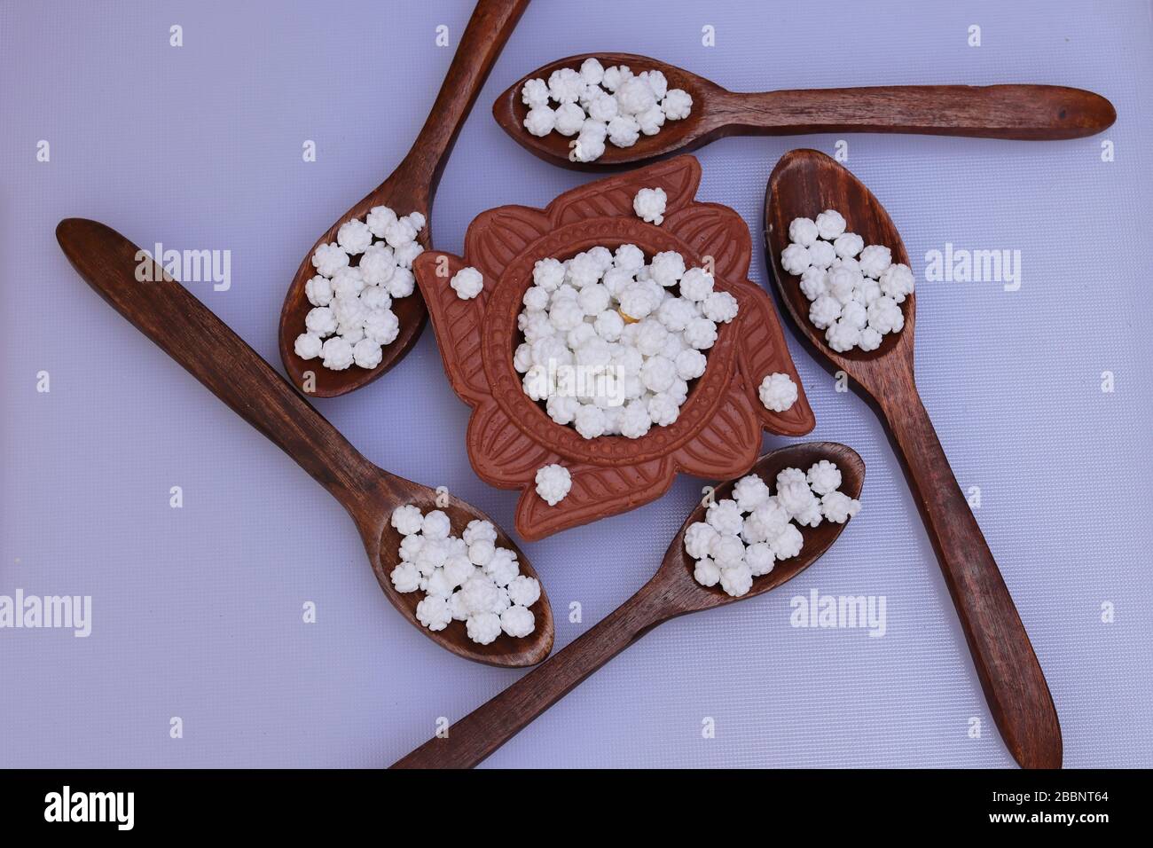 Nakul dana, sweet that made by sugar use as prasad in india Stock Photo ...