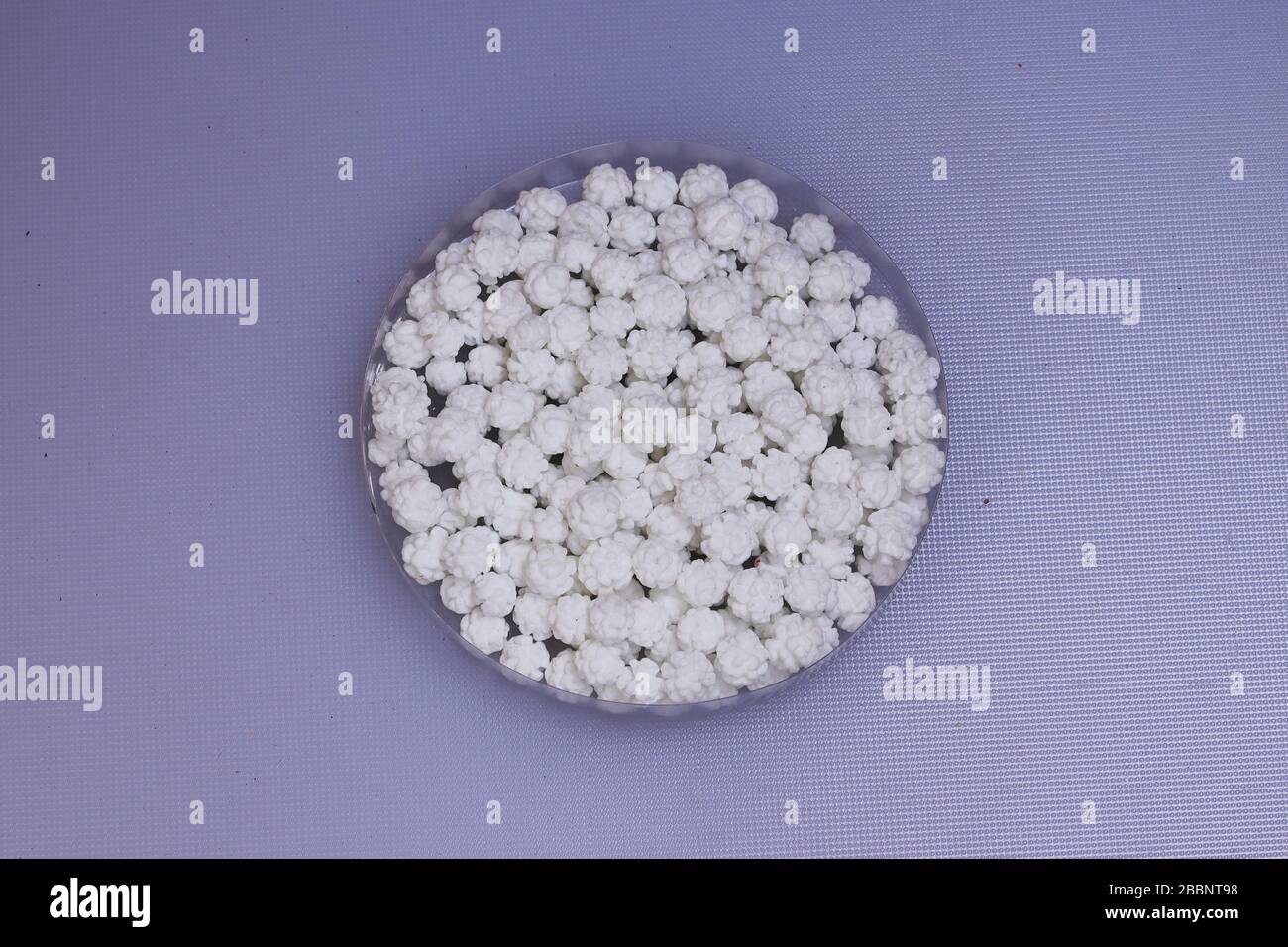 Nakul dana, sweet that made by sugar use as prasad in india Stock Photo ...