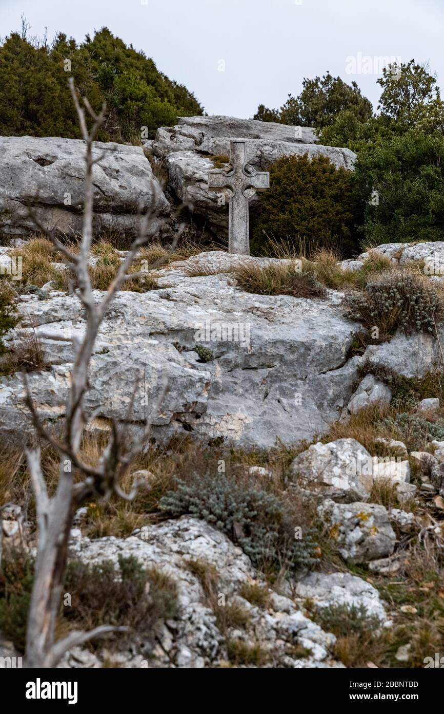 The sacred cross St.Pilon is on the mountain in cloudy weather, clouds ...