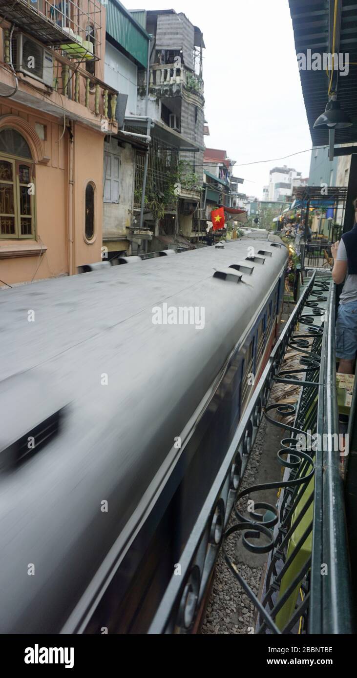 train crossing famous train street in hanoi vietnam Stock Photo - Alamy