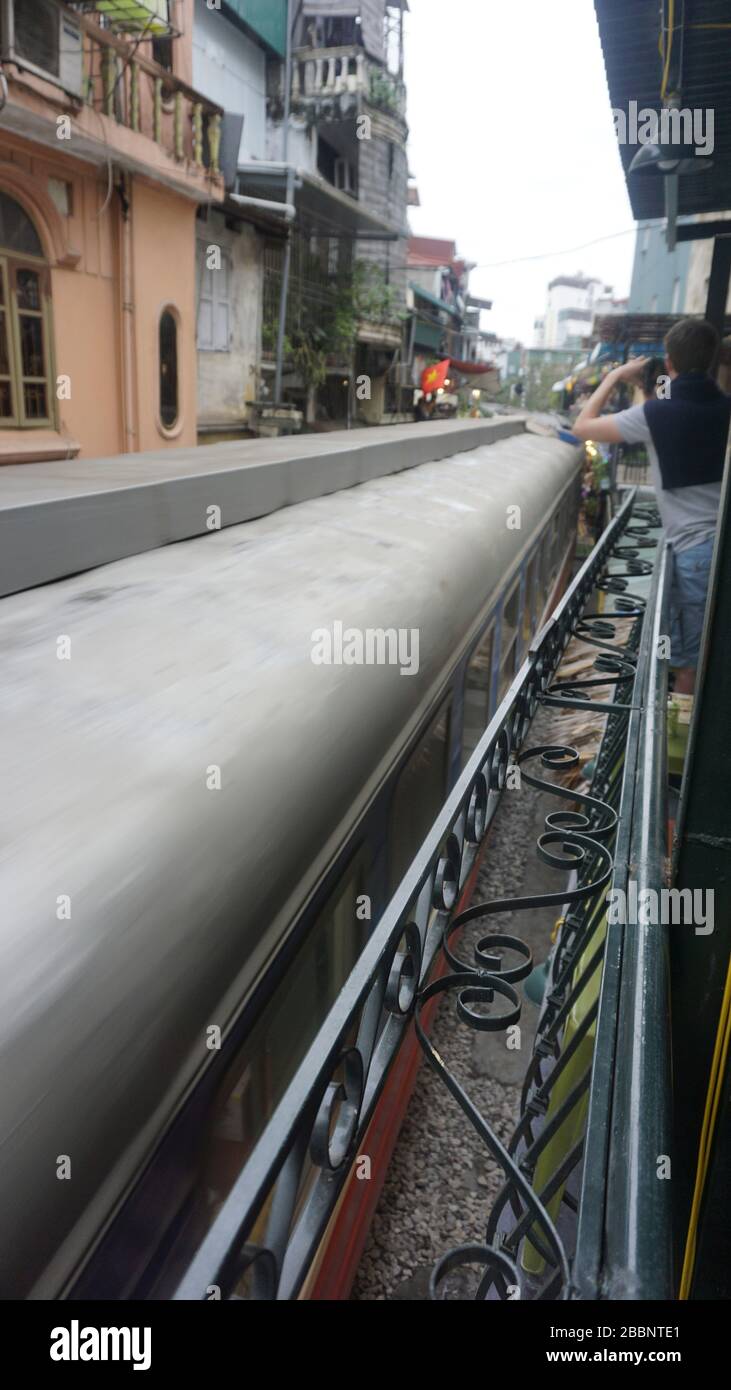 train crossing famous train street in hanoi vietnam Stock Photo - Alamy