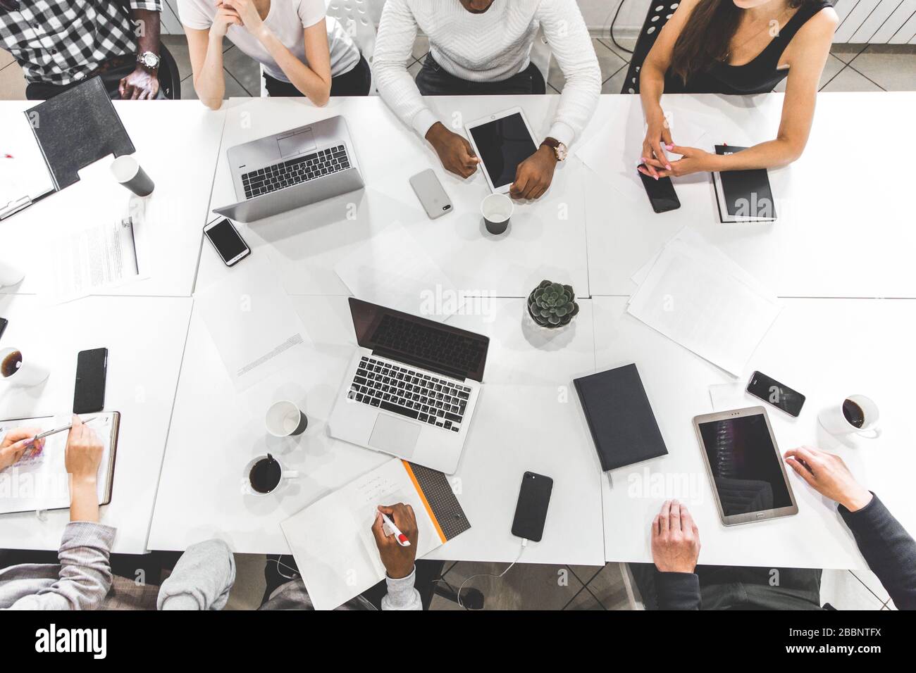 top view work workplace. A team of young office workers, businessmen ...