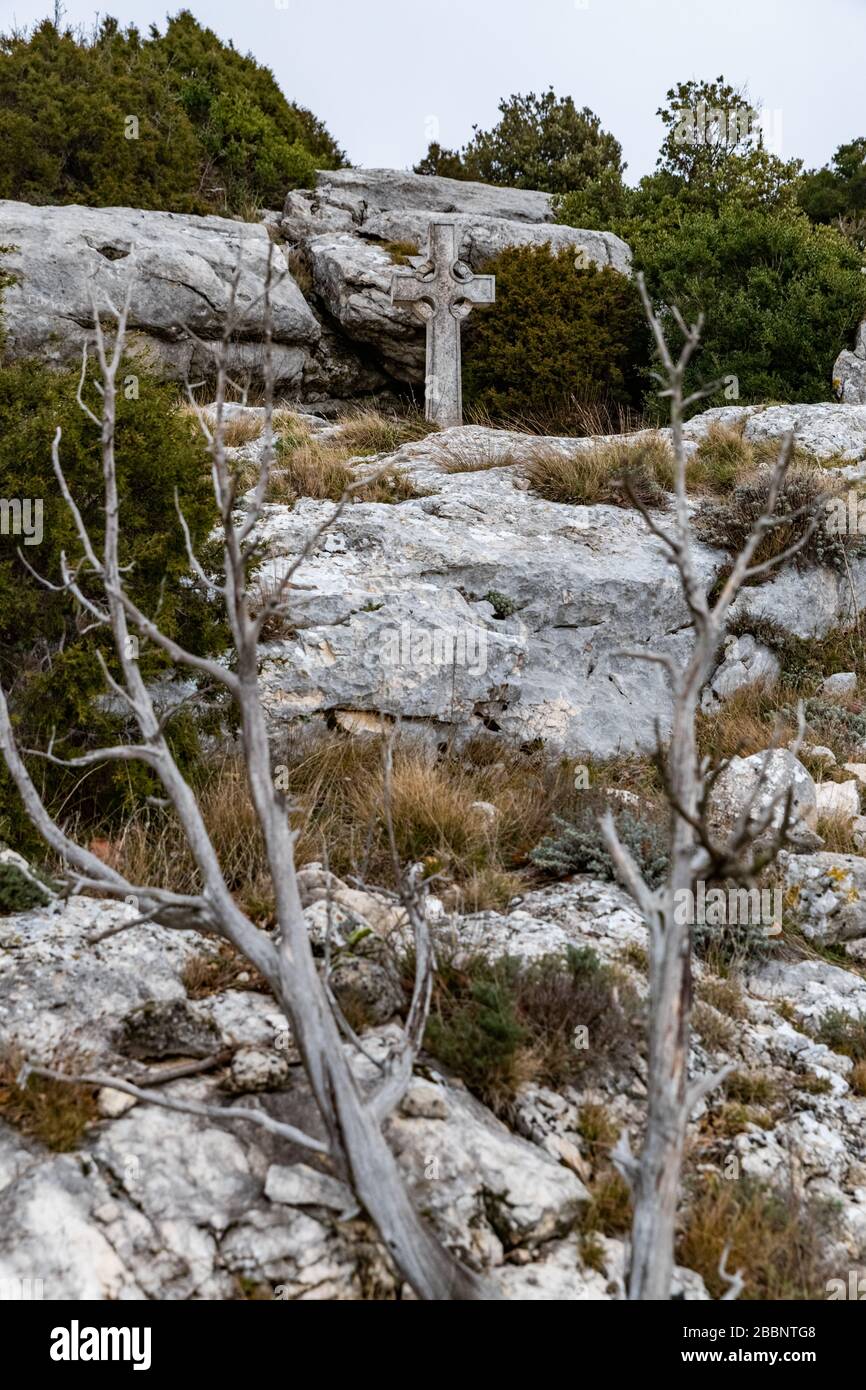 The sacred cross St.Pilon is on the mountain in cloudy weather, clouds ...