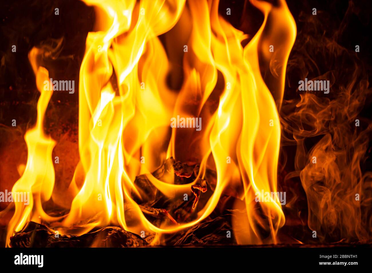Close up on flamme burning in the fireplace during a cold winter night ...