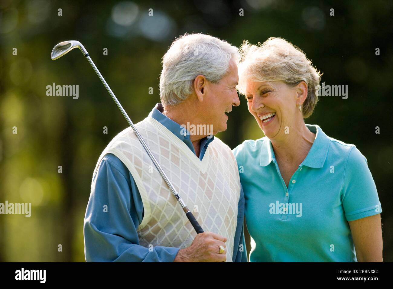 Senior woman playing golf holding club hi-res stock photography and ...