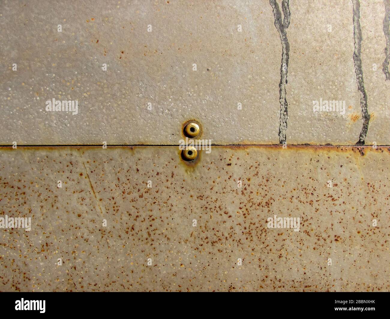 Two Rusty Metal Sheets Connected in the Middle Stock Photo - Alamy