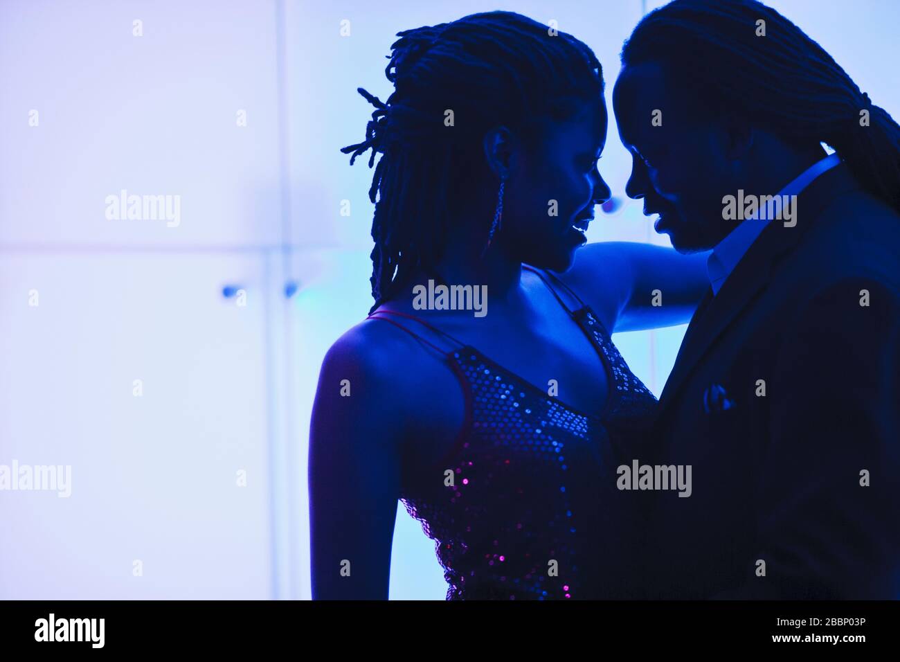 Two young people flirting nightclub hi-res stock photography and images ...