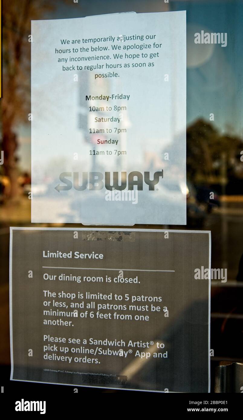 sign for a Subway sandwich shop stating that the dining room is closed ...